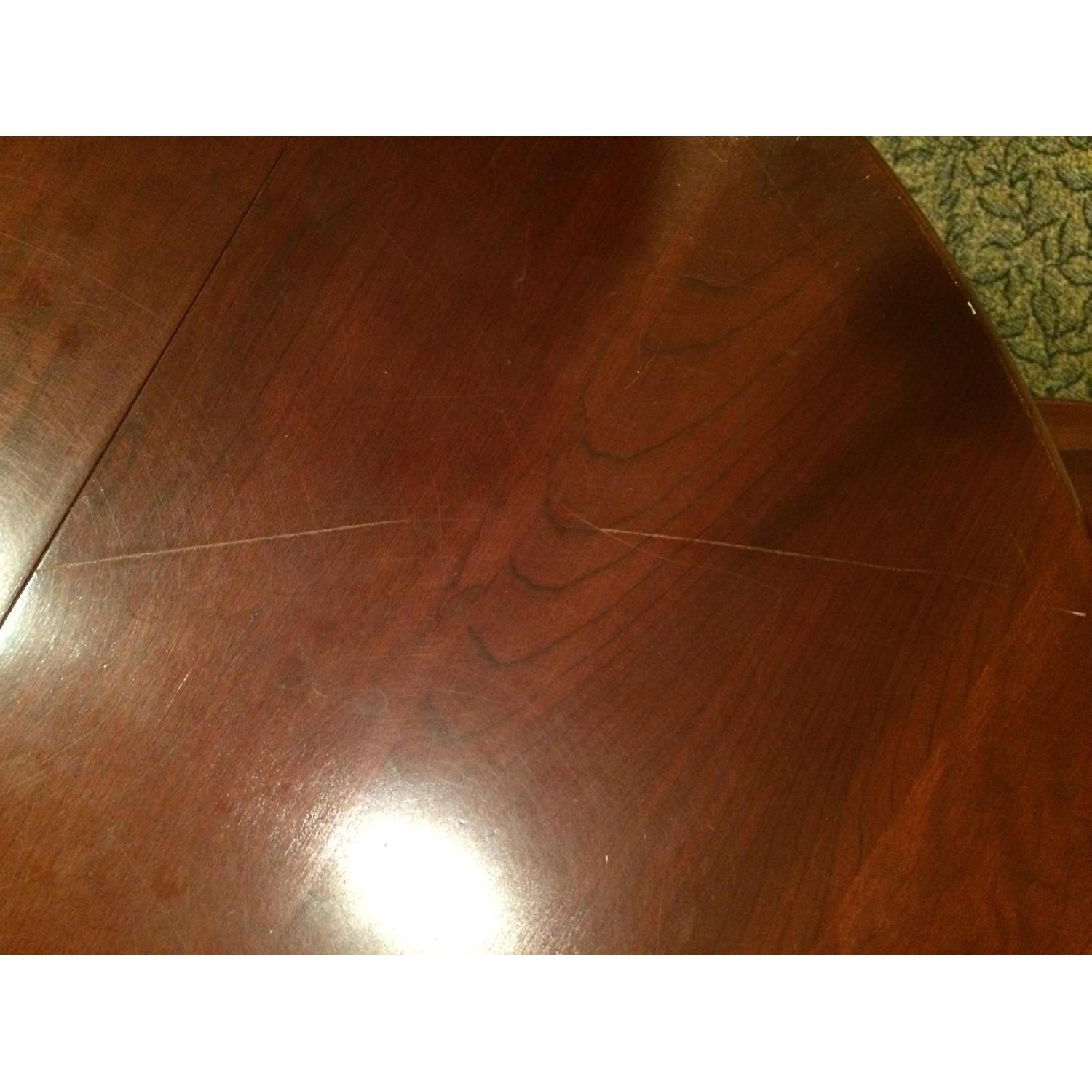 Amish Cherry Wood Round To Oval Pedestal Table w/ 6 Sheaf Back Chairs - AptDeco