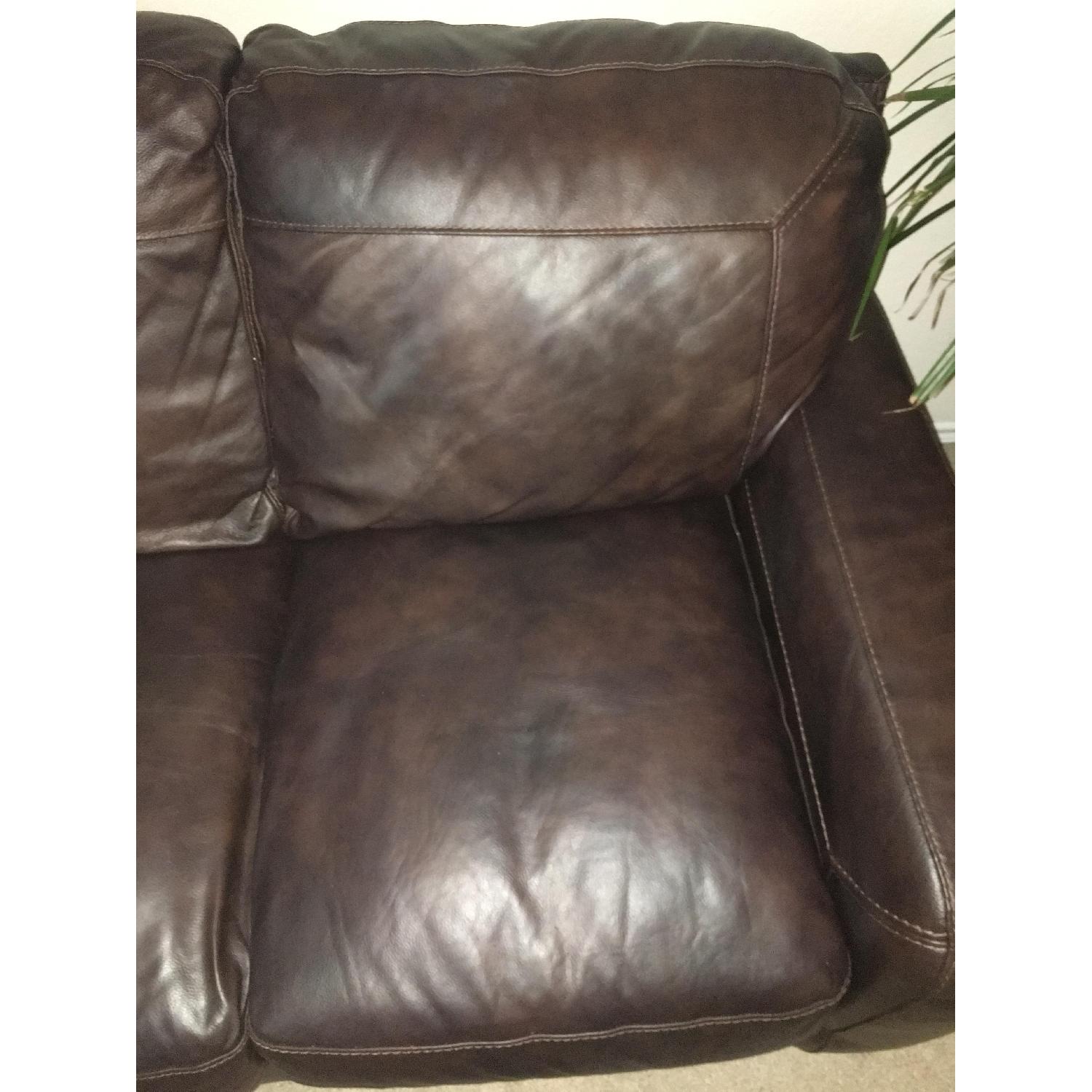 Ashley's Crestwood Walnut Leather Sofa - AptDeco