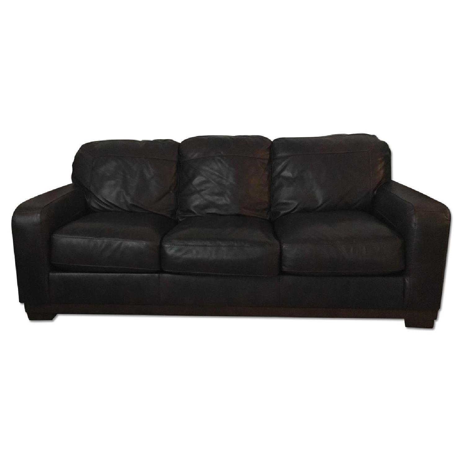 Ashley's Crestwood Walnut Leather Sofa - AptDeco