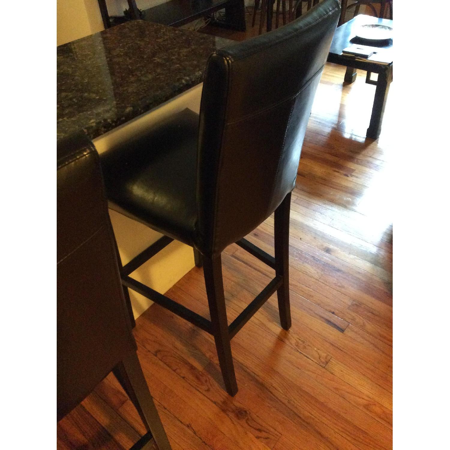 Pier 1 Black Leather Bar Stools - AptDeco