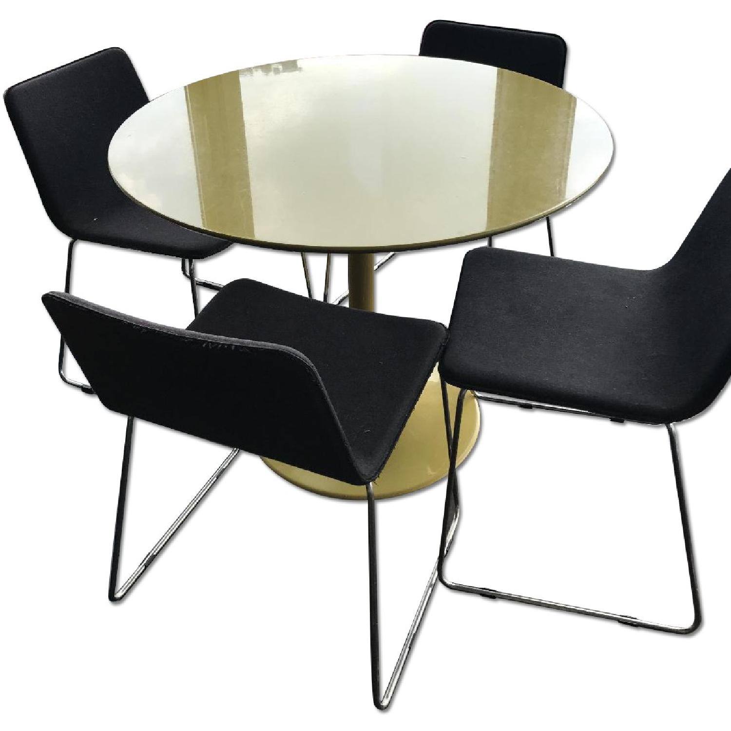CB2 Round Dining Table w/ 4 Chairs - AptDeco
