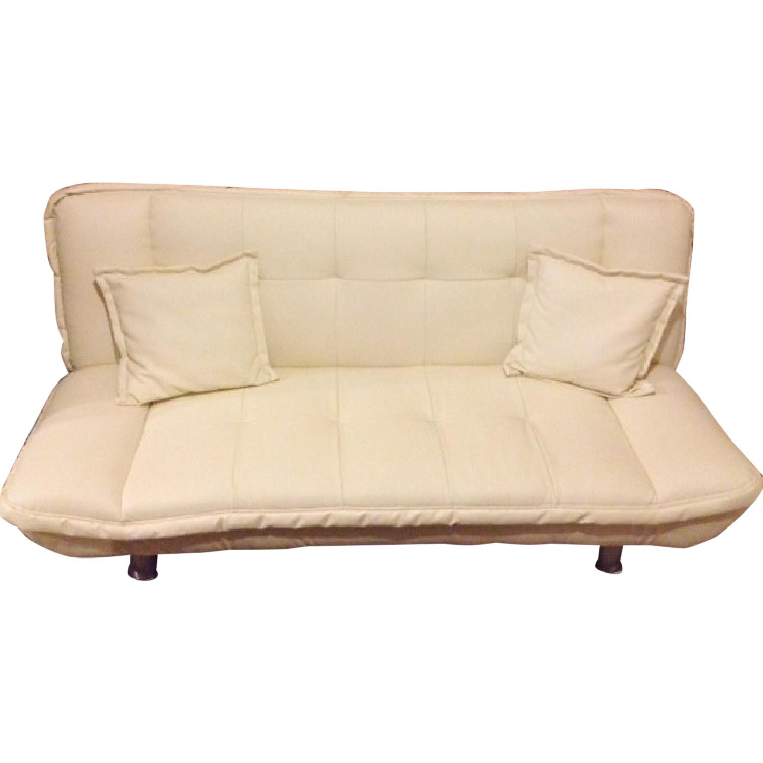 Cream Faux Leather Tufted Convertible Futon - AptDeco
