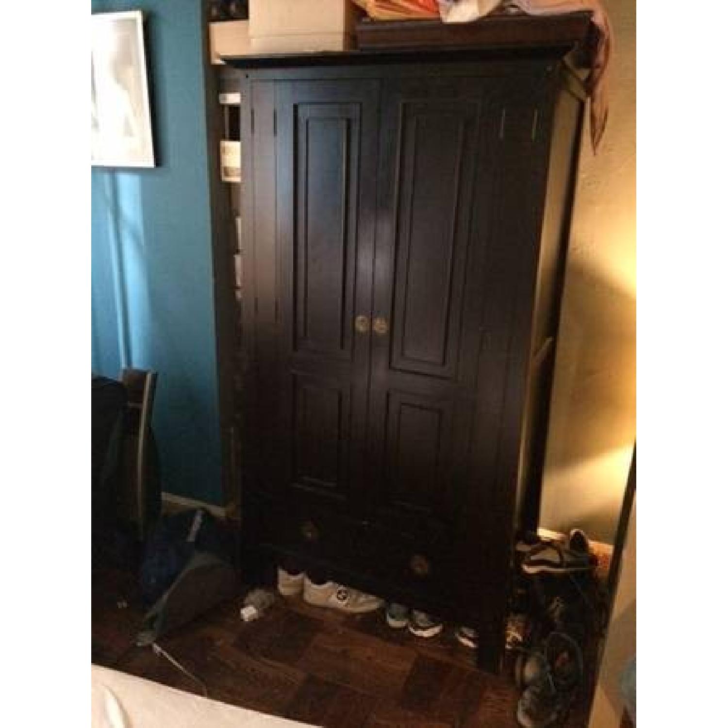 Pier 1 Ebony Cabinet/Armoire - AptDeco