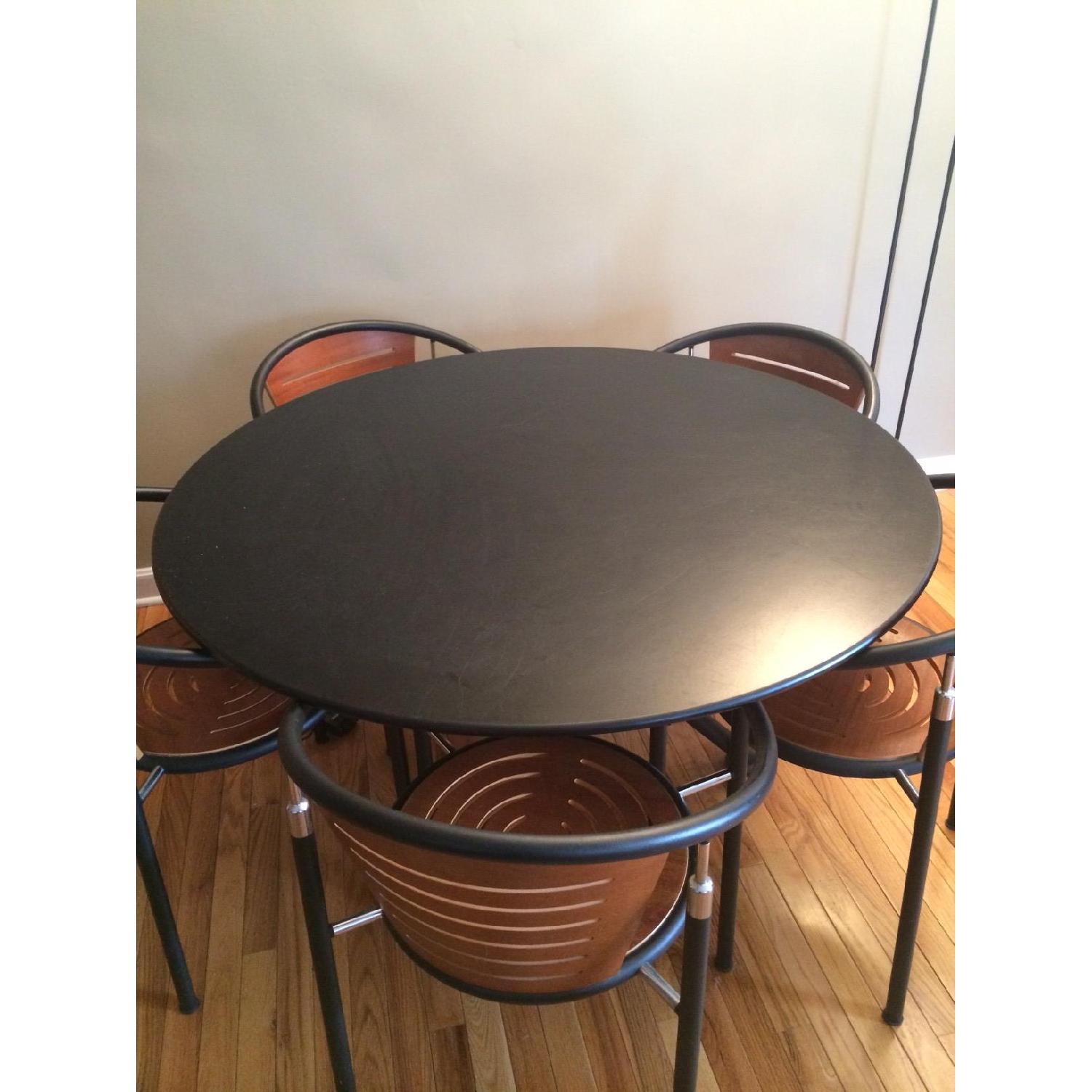 Johnny Sorenson & Rud Thygesen Round Dining Table w/ 5 Chairs - AptDeco