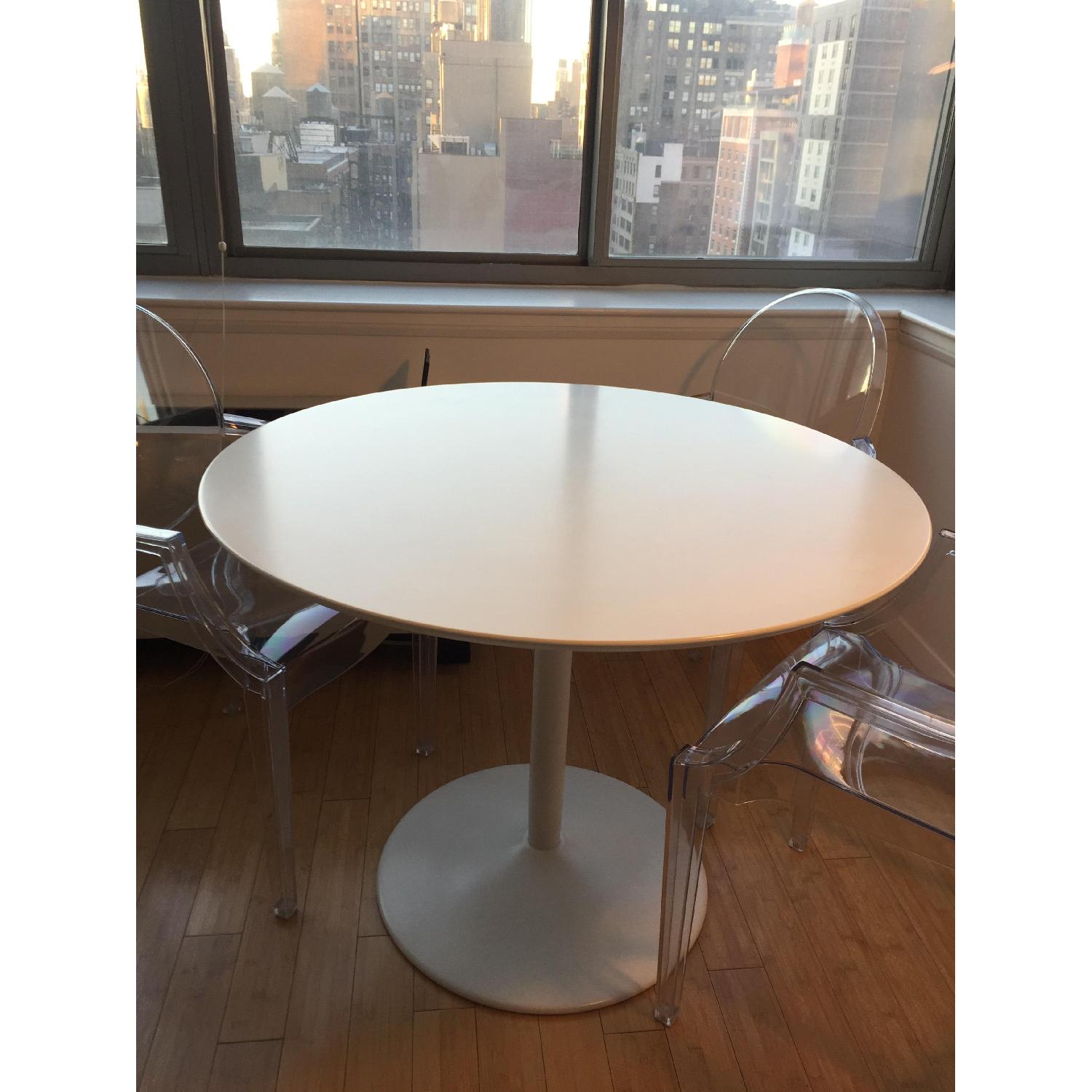 CB2 White Round Dining Table - AptDeco