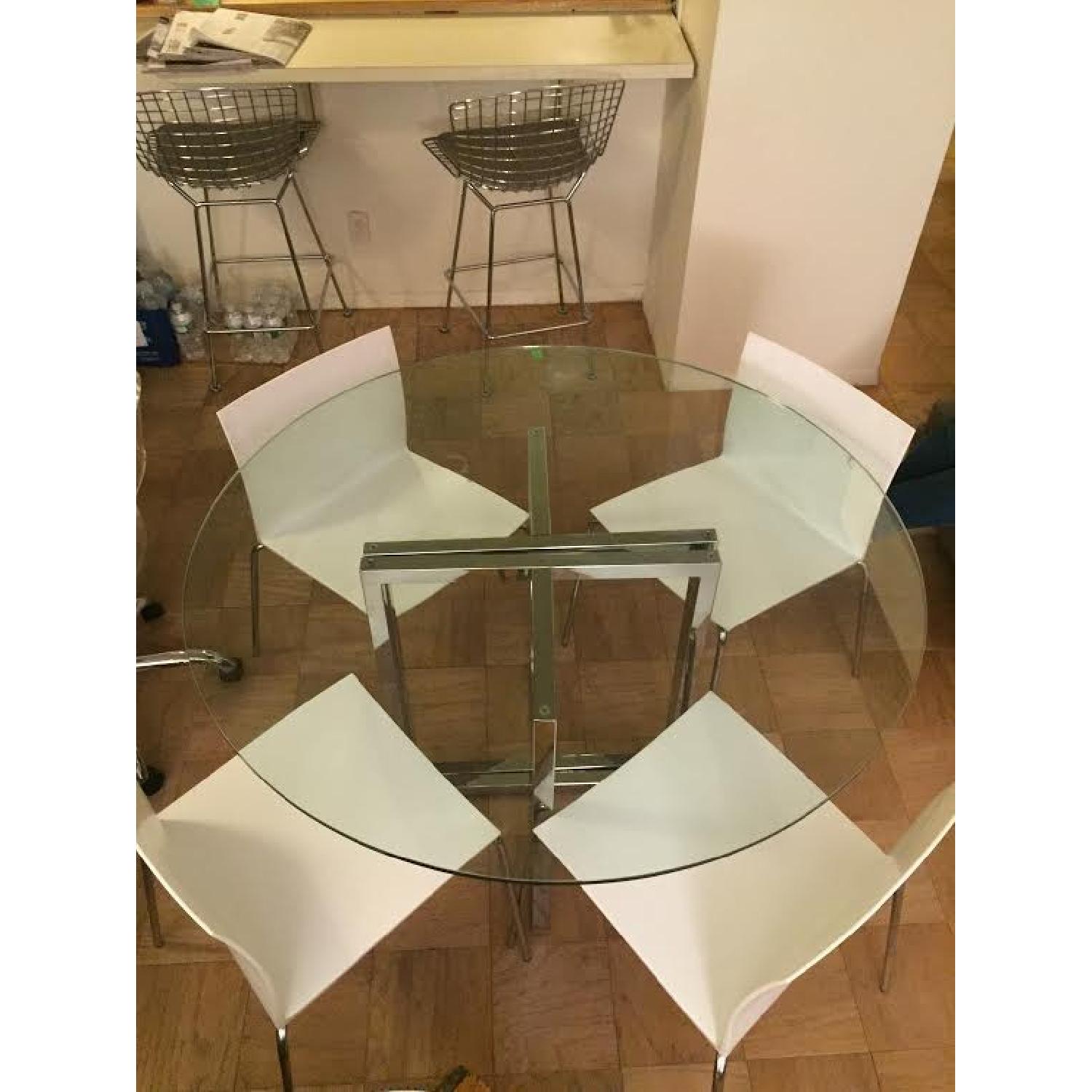 CB2 Silverado Chrome Round Dining Table w/ 4 Slim White Chairs - AptDeco