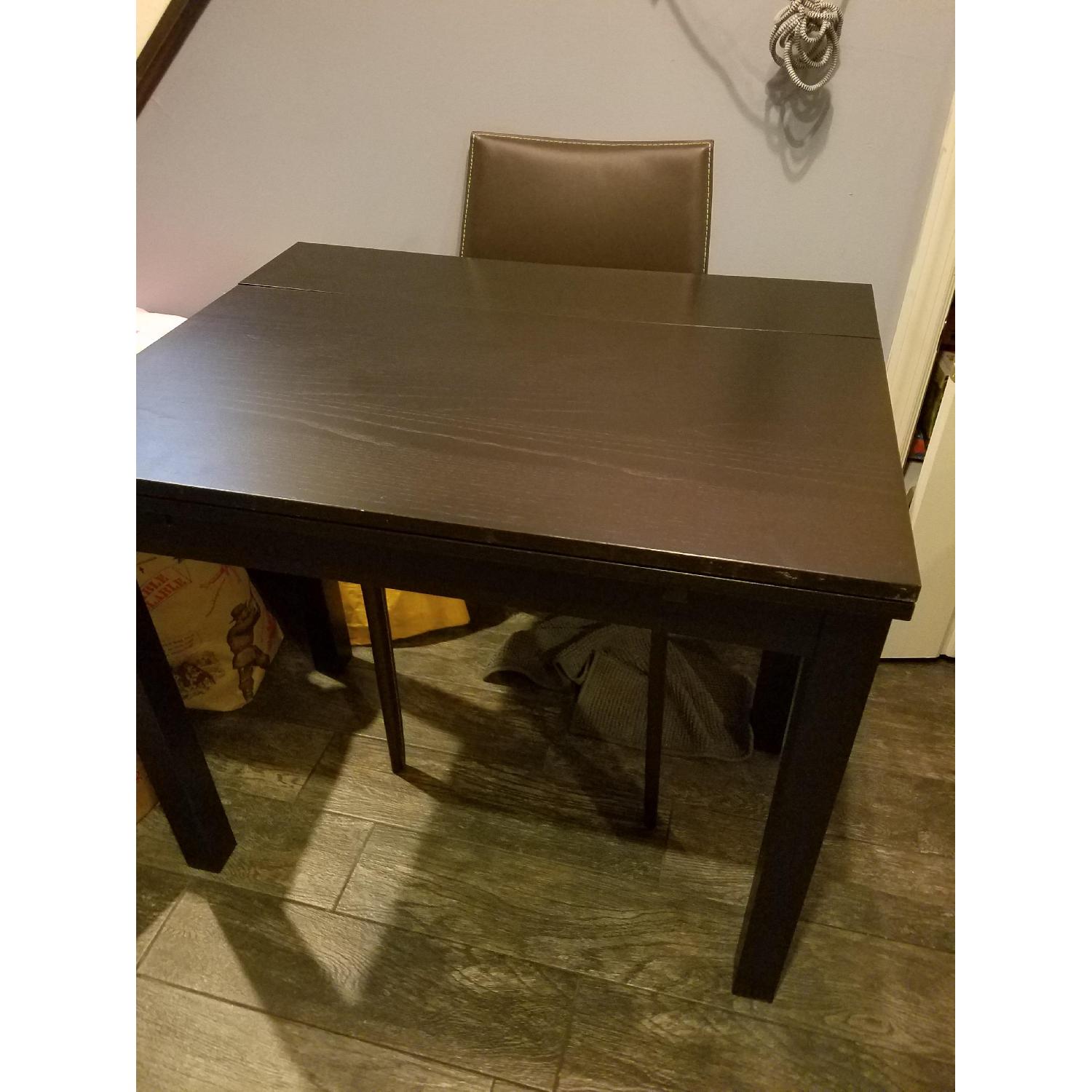 Ikea Bjursta Expandable Wood Dining Table - AptDeco