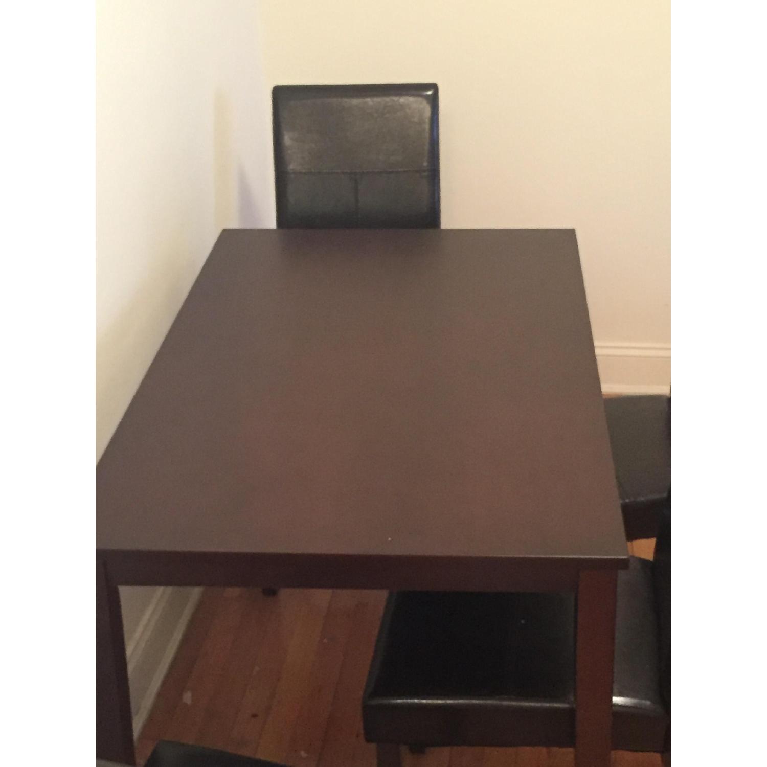 Dark Brown Wood Dining Table - AptDeco