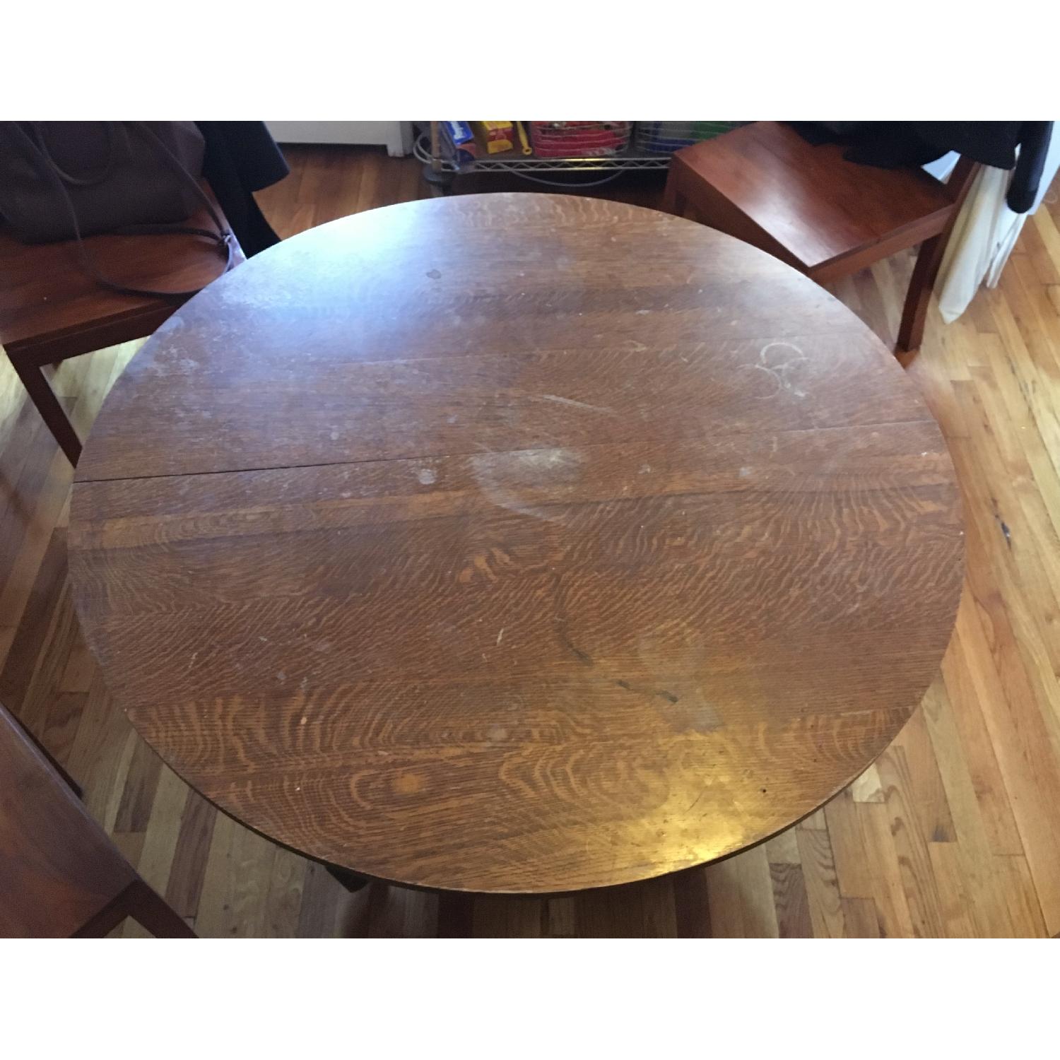 Antique Round Wooden Dining Table on Wheels - AptDeco