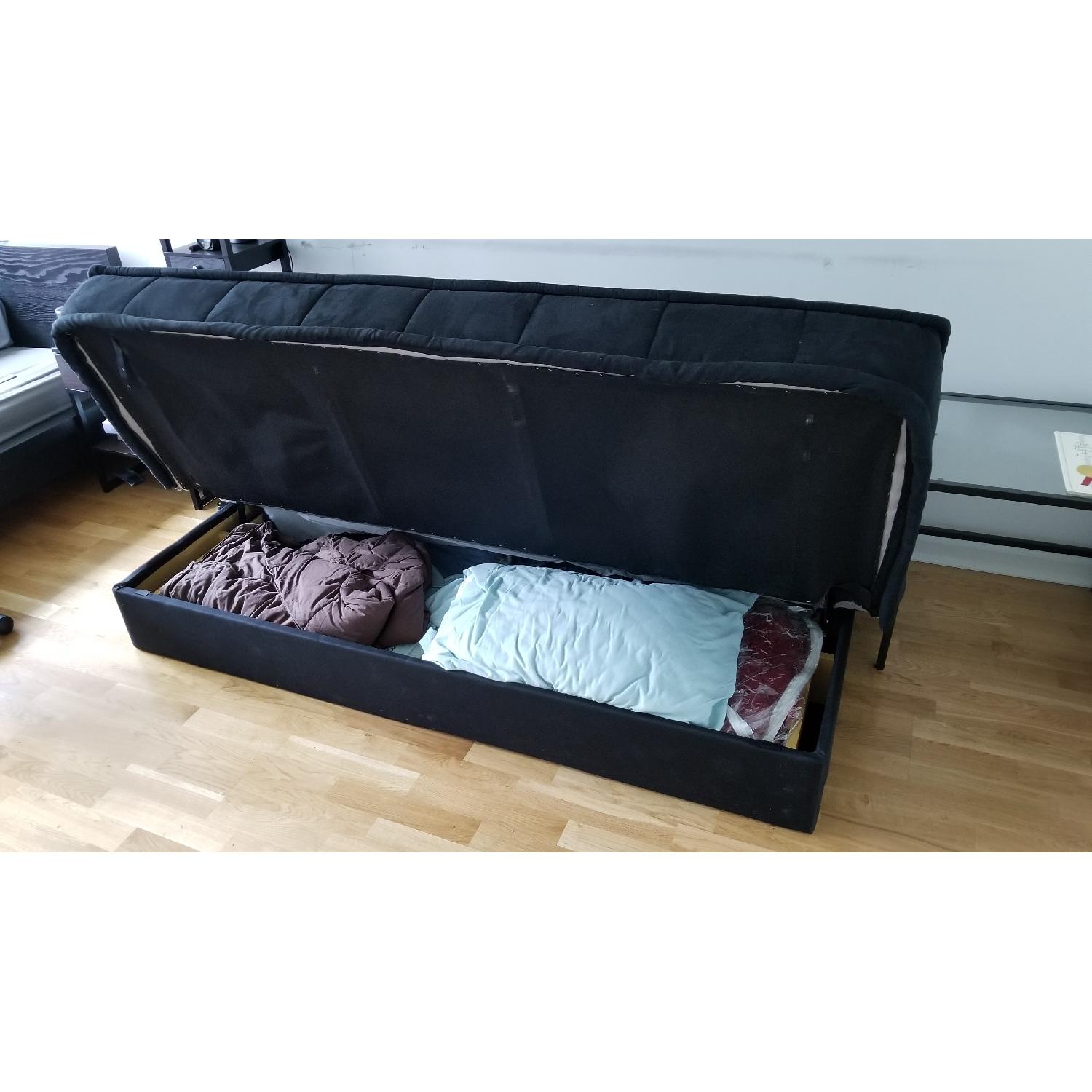 Sauder Lincoln Black Futon w/ Storage - AptDeco