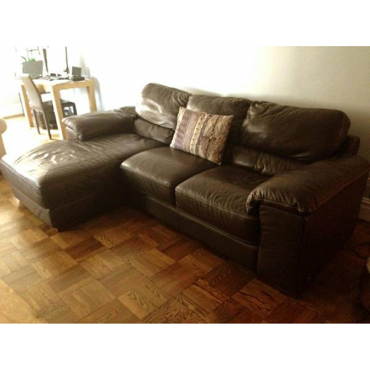 Raymour & Flanigan Brown Leather Sofa w/ Chaise - AptDeco