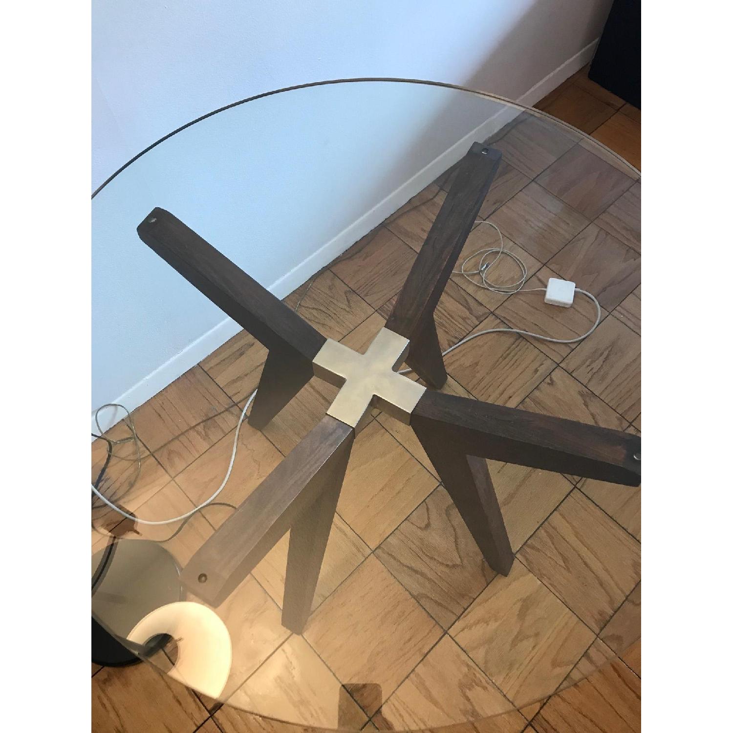 Crate & Barrel Strut Glass Top Round Table - AptDeco