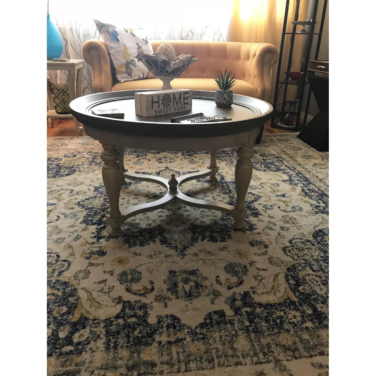Pier 1 Shadow Gray Round Coffee Table - AptDeco