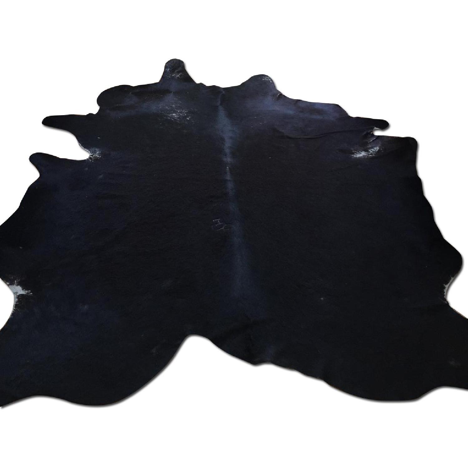 Ikea Black Cowhide Rug - AptDeco