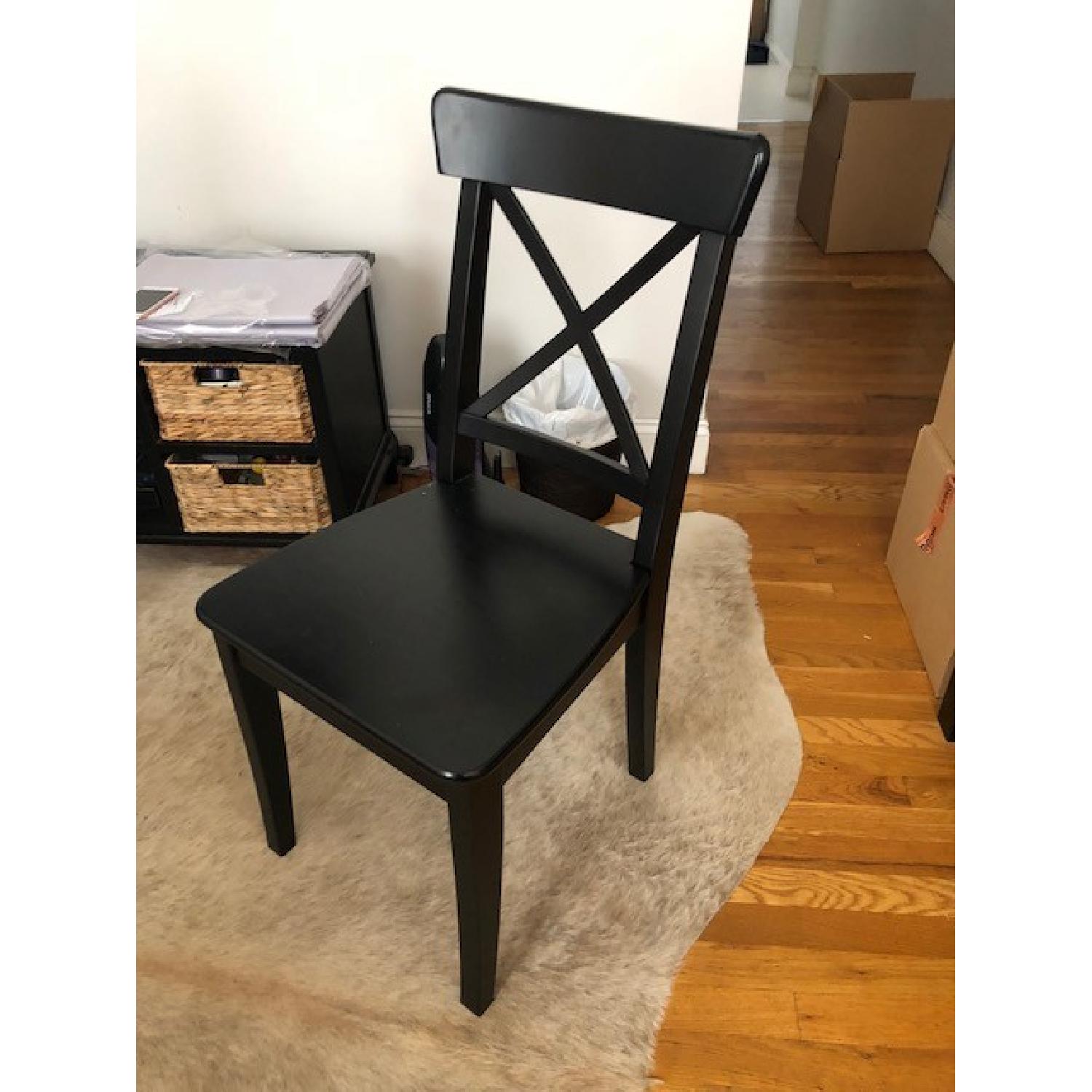 Ikea Black Wood Dining Table w/ 2 Chairs - AptDeco