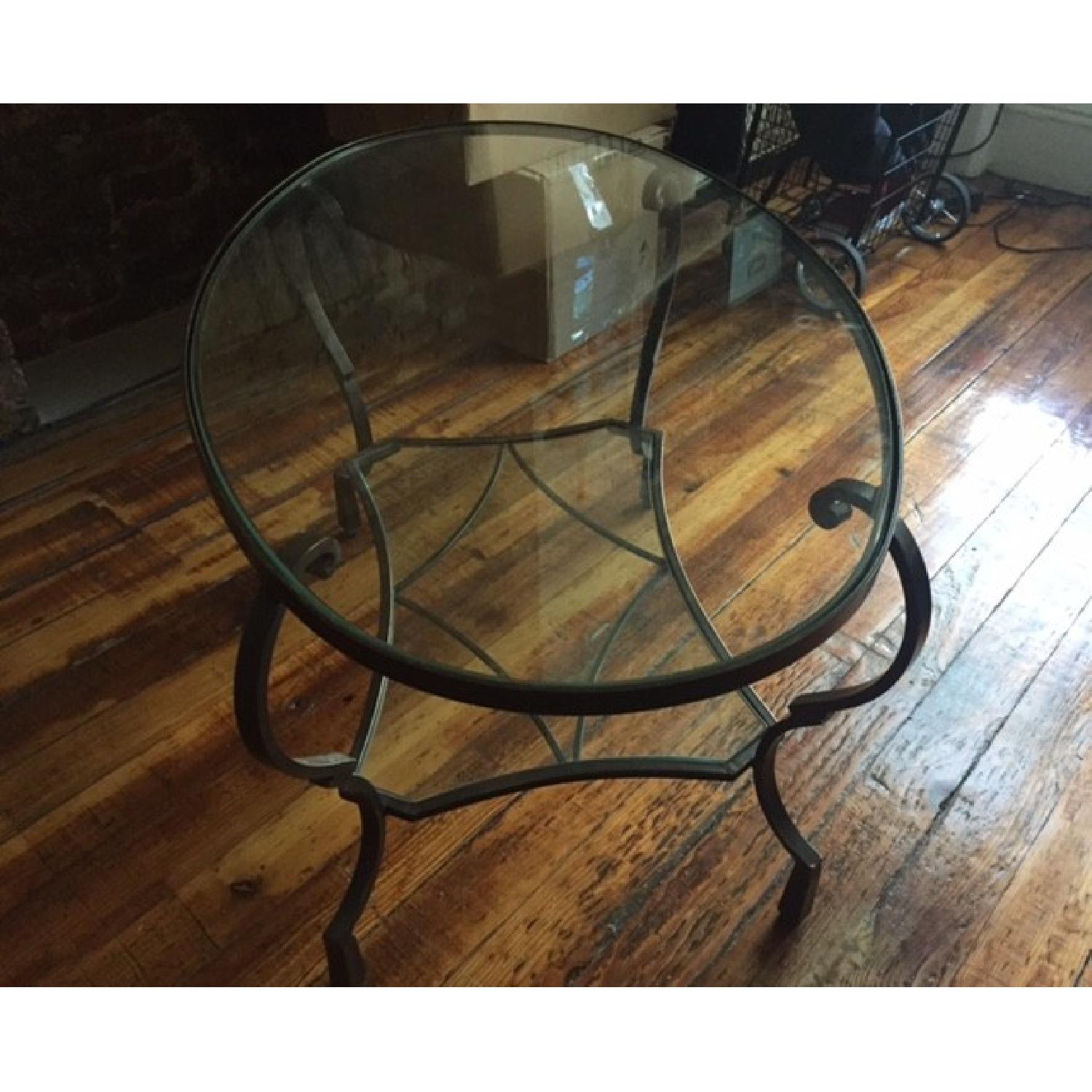 Pier 1 Chasca Glass Top Brown Oval Coffee Table - AptDeco