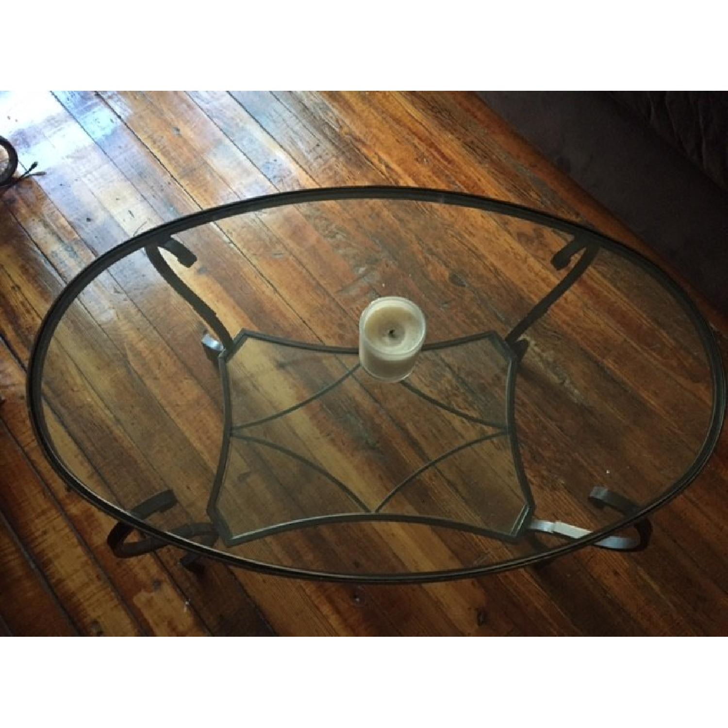 Pier 1 Chasca Glass Top Brown Oval Coffee Table - AptDeco