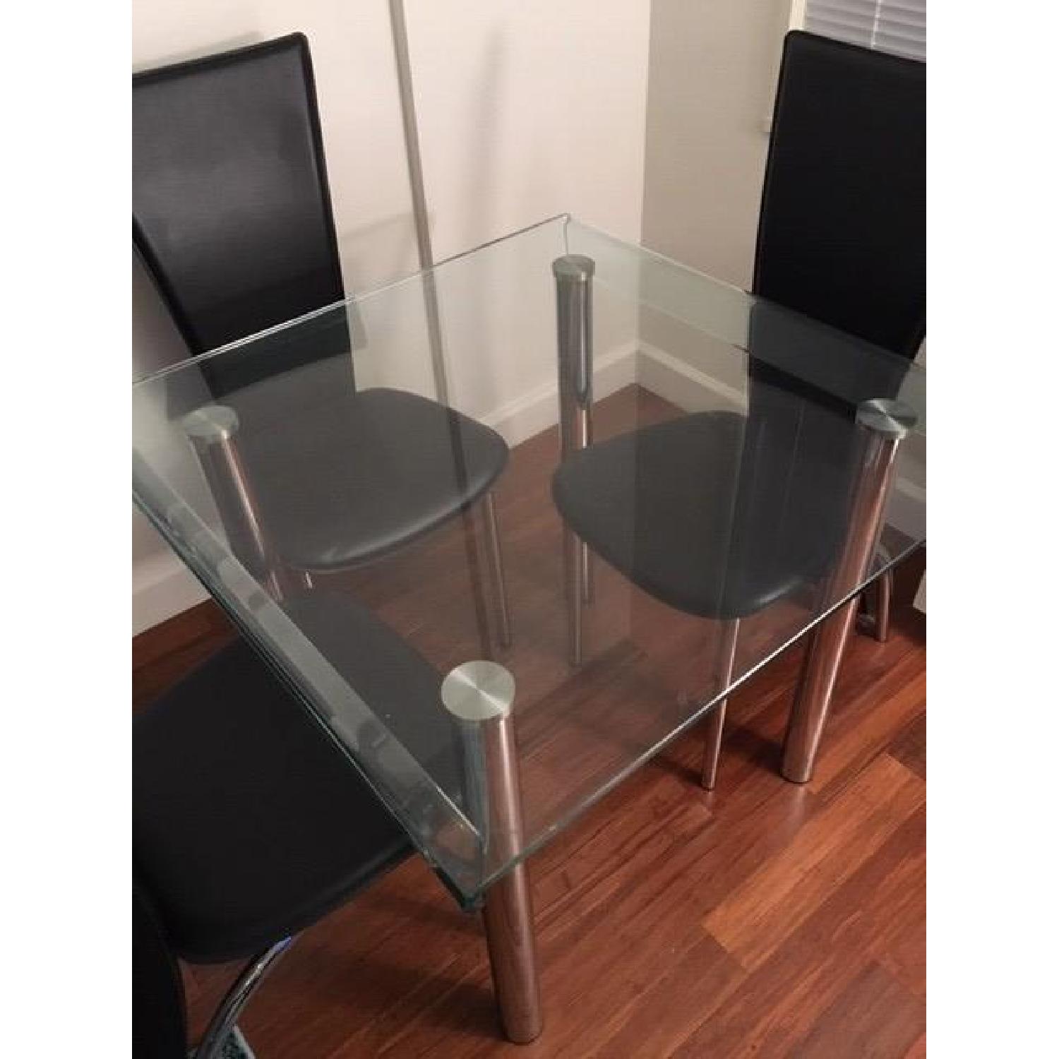 Raymour & Flanigan Glass & Chrome Dining Table w/ 4 Chairs - AptDeco