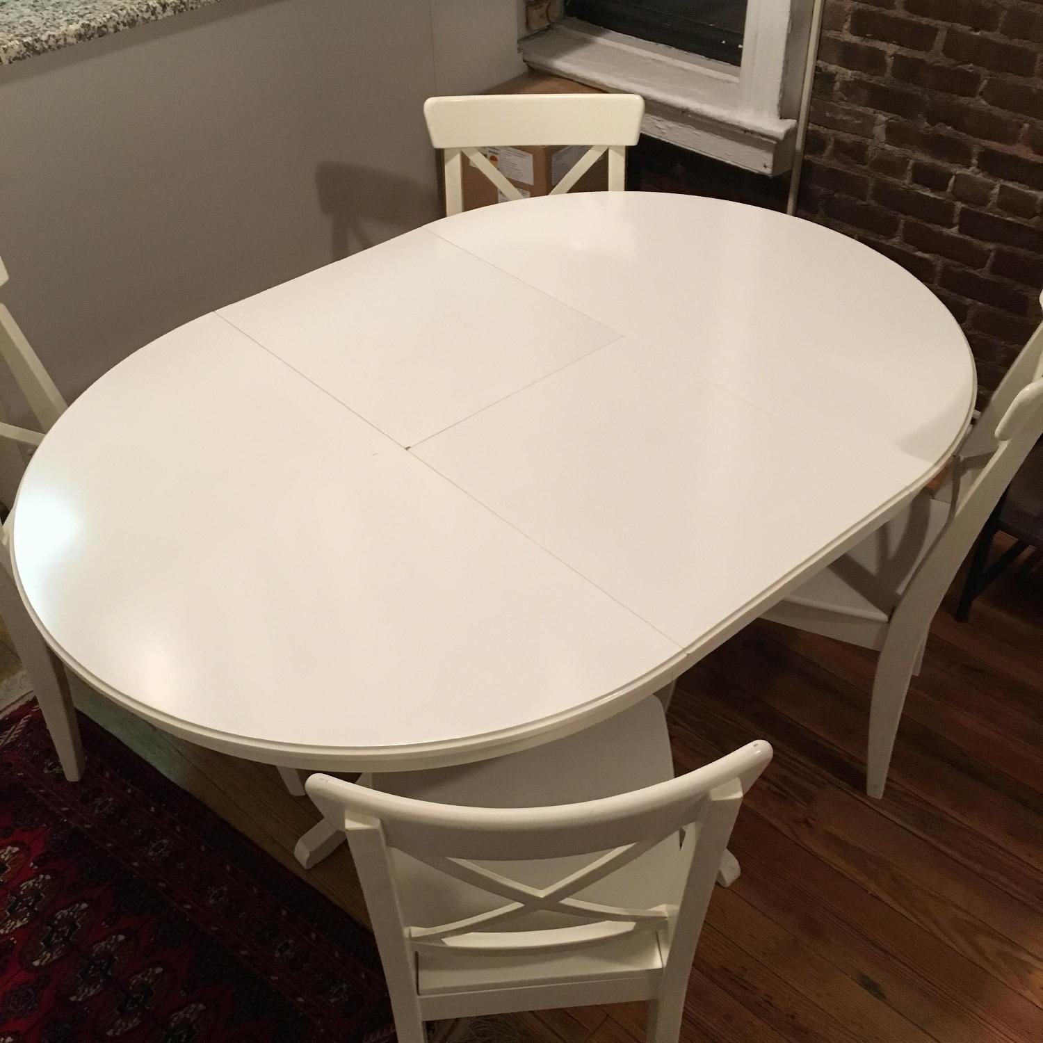 Ikea White Pedestal Extendable Dining Table w/ 4 Chairs - AptDeco