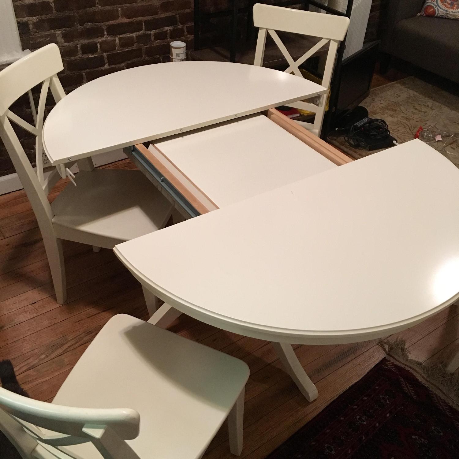 Ikea White Pedestal Extendable Dining Table w/ 4 Chairs - AptDeco