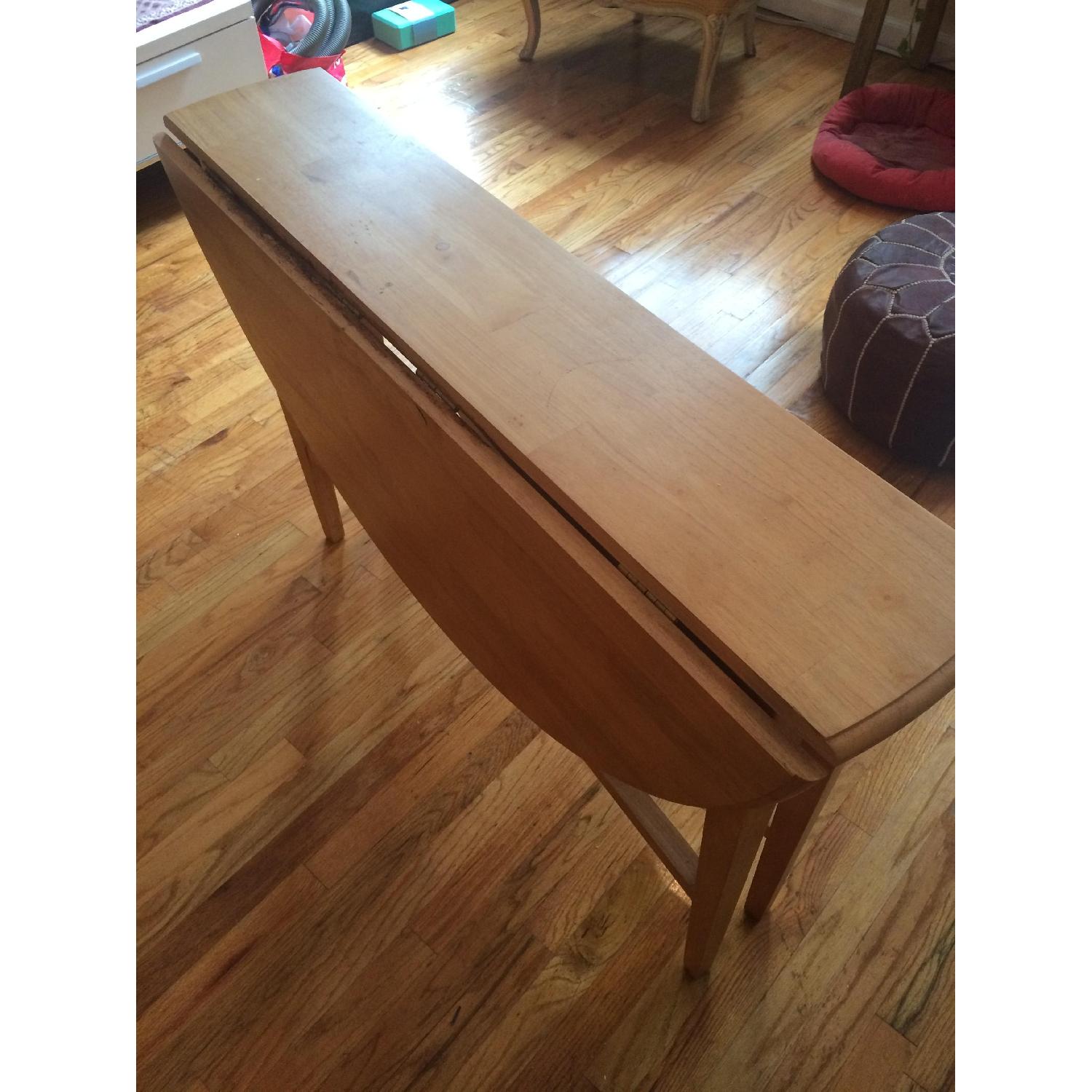 Double Drop-Leaf Round Wood Dining Table - AptDeco