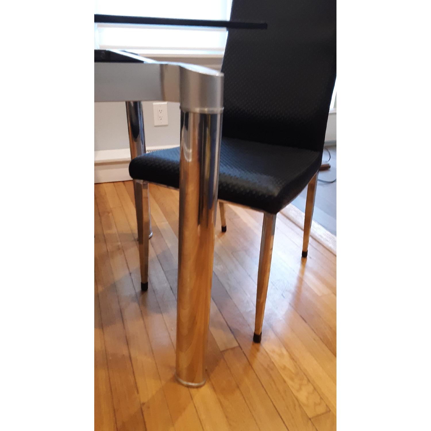 Sliding Extendable Dining Table - AptDeco