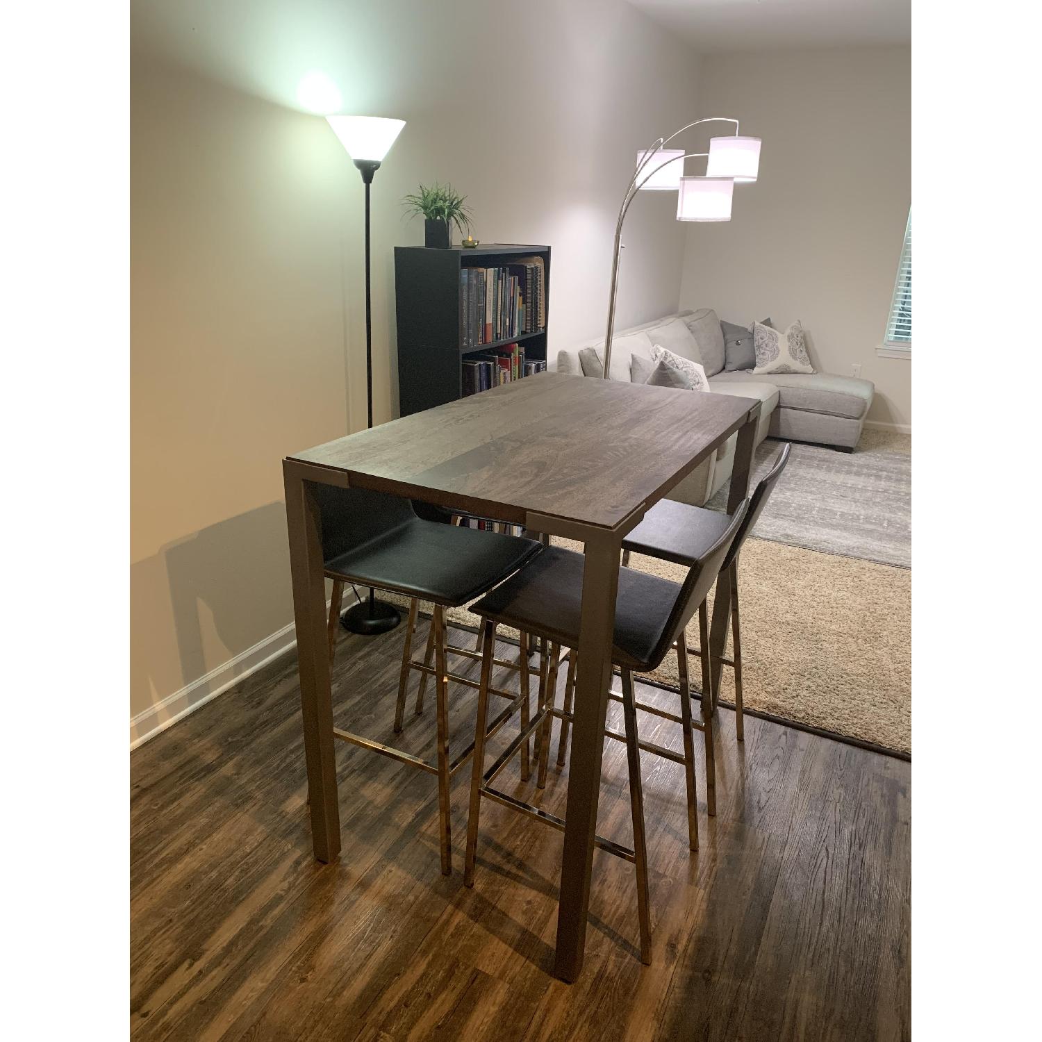 CB2 Stilt Dining Table w/ 4 Carbon Grey Bar Stools - AptDeco