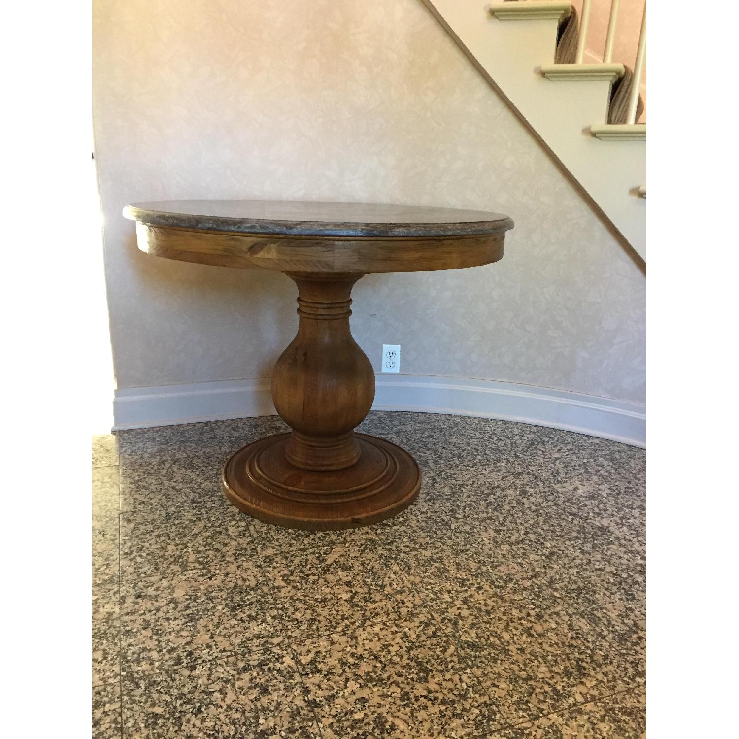 Arhaus Luca Round Dining Table w/ Bluestone Top in Barnwood Brown - AptDeco