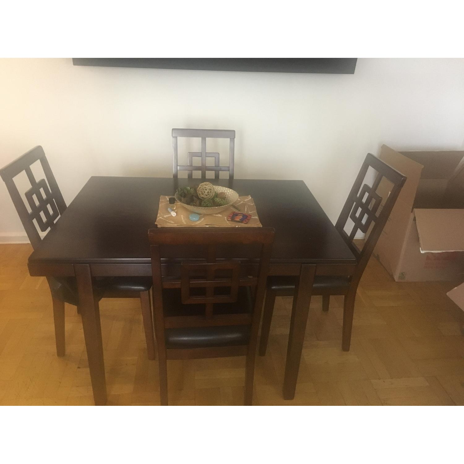 Jennifer Convertibles Cherry Wood Dining Table w/ 4 Chairs - AptDeco