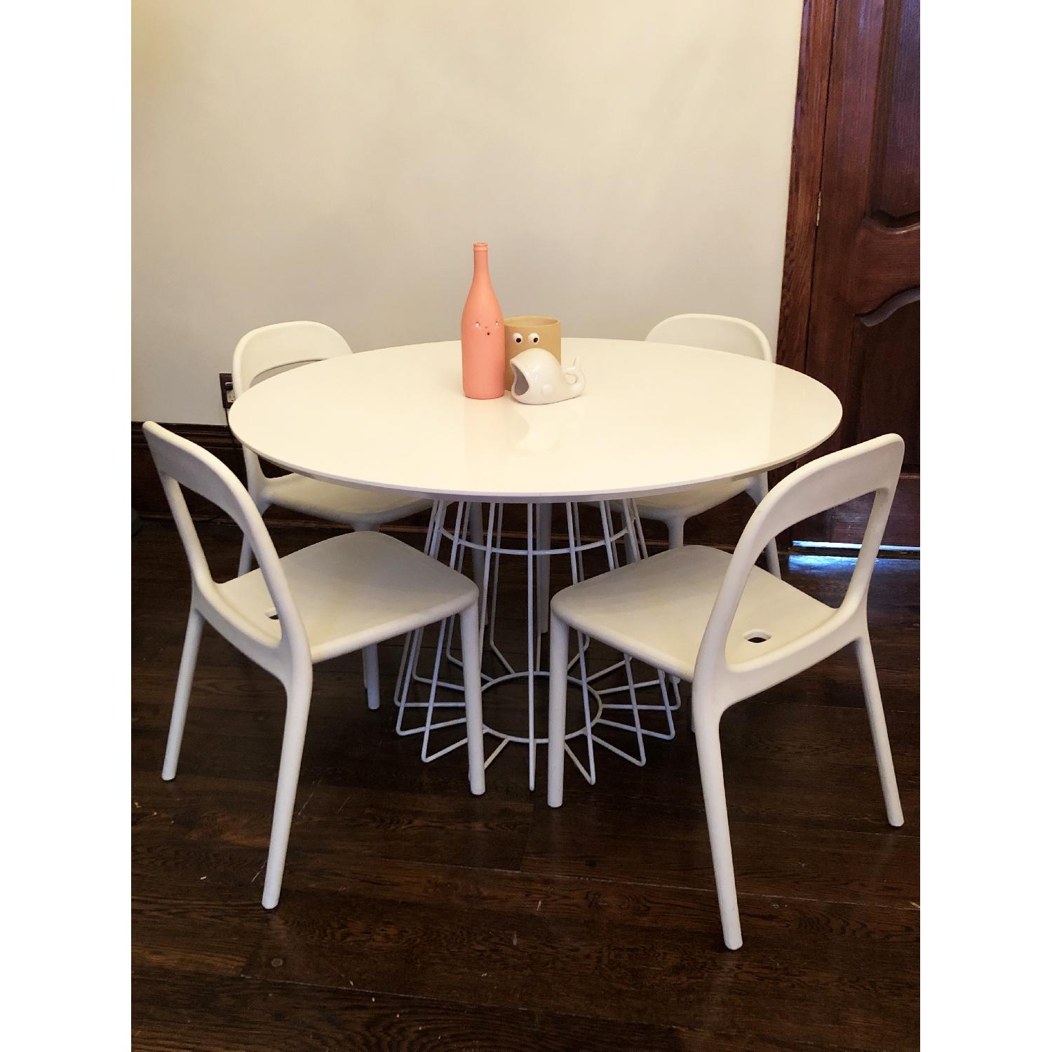CB2 White Round Dining Table - AptDeco