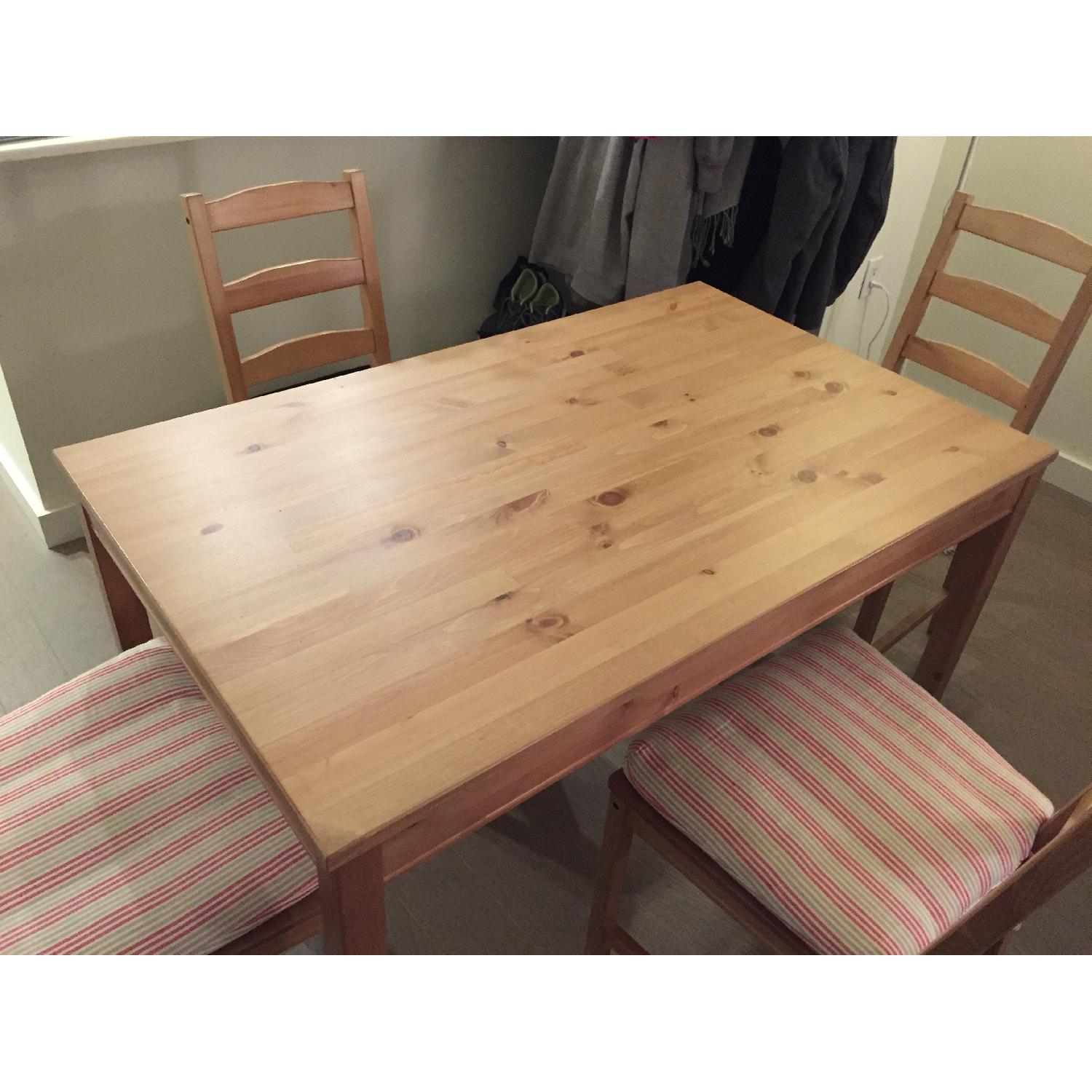 Ikea Pine Wood Table w/ 4 Cushioned Chairs - AptDeco