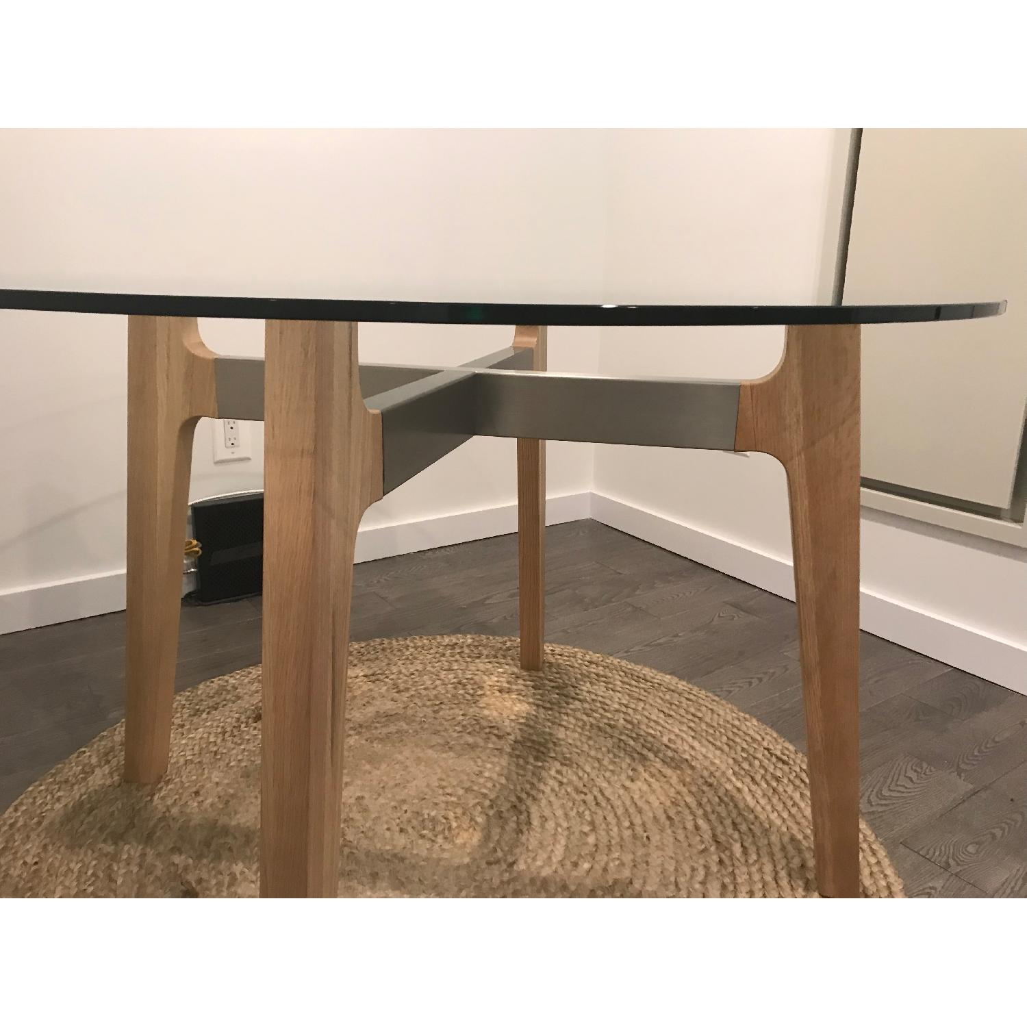 CB2 Brace Round Glass Dining Table - AptDeco