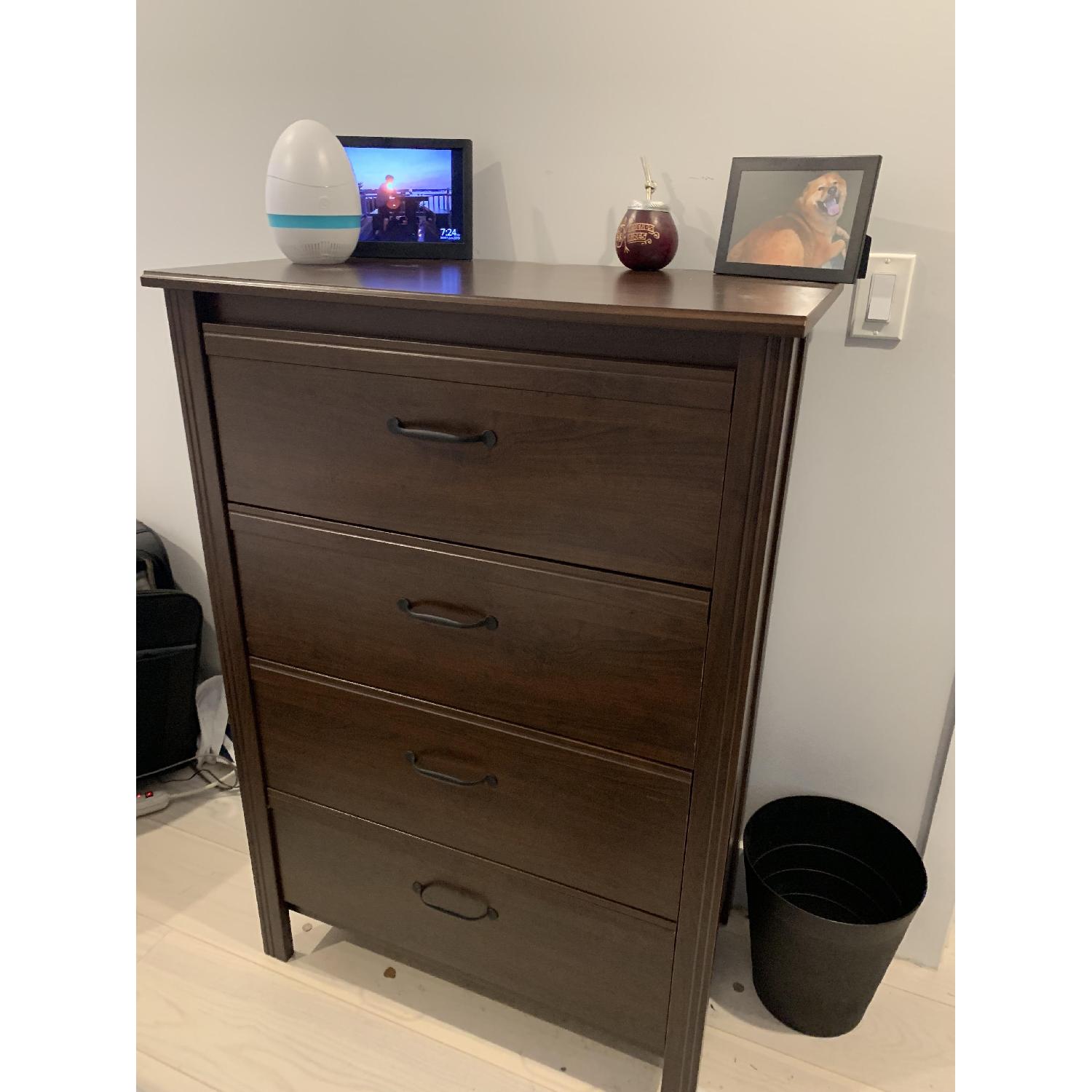 Ikea Dark Wood 4 Drawer Dresser - AptDeco