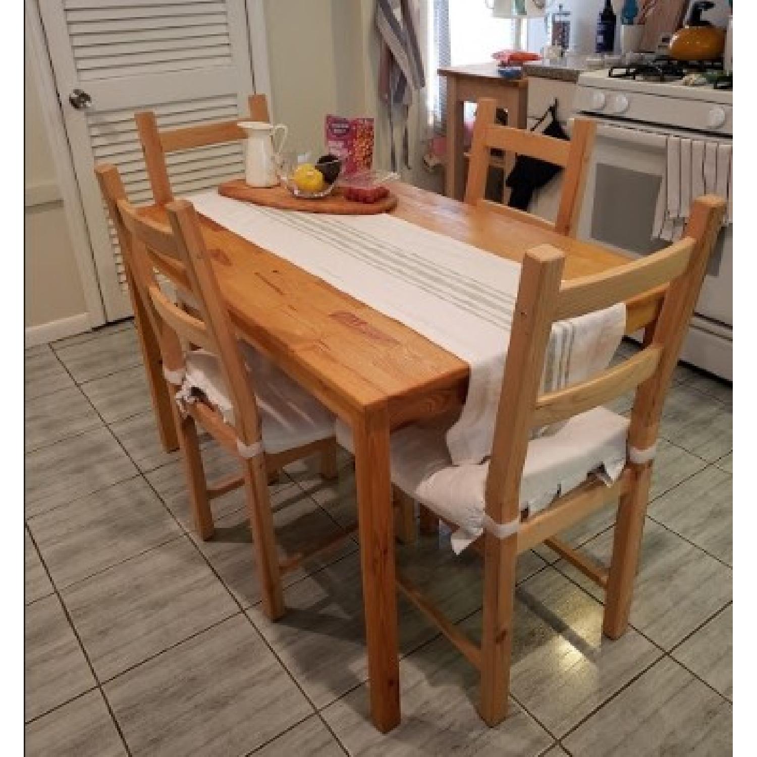 Ikea Ingo Natural Pinewood Dining Table w/ 4 Chairs - AptDeco