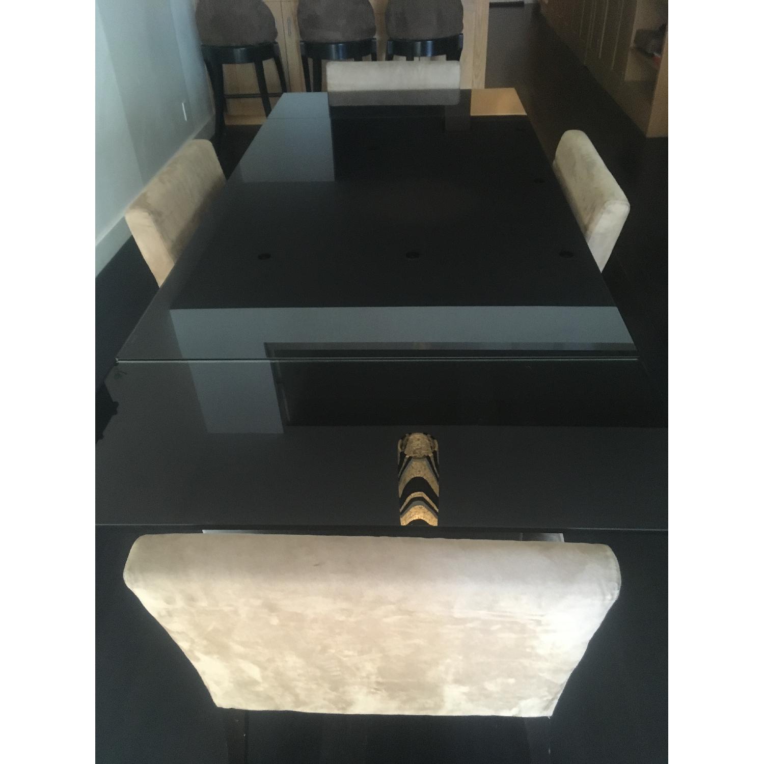 Expandable Black Tempered Glass Dining Table - AptDeco