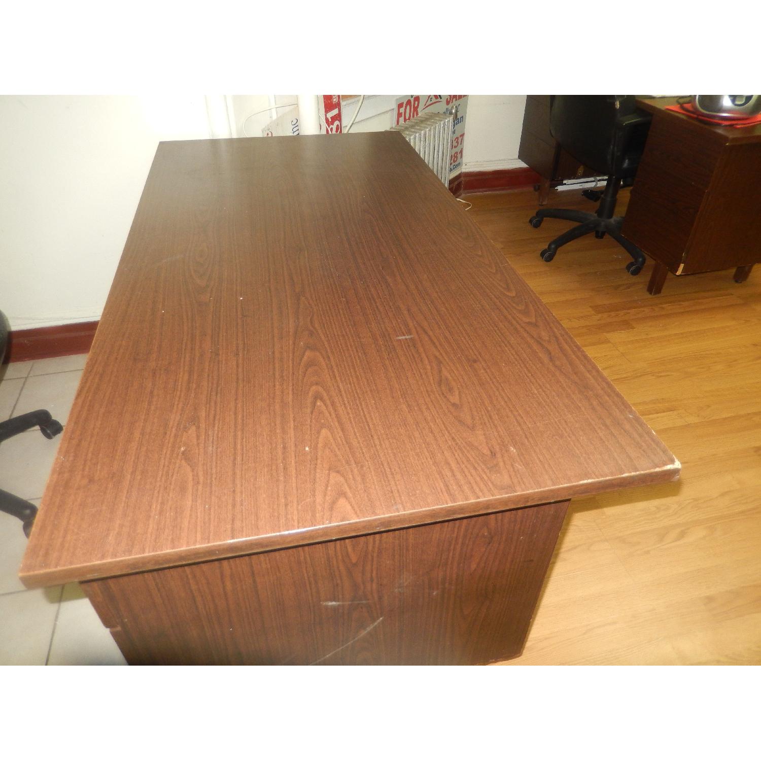 Cort Furniture Solid Wooden Office Desk w/ 5 Drawers - AptDeco