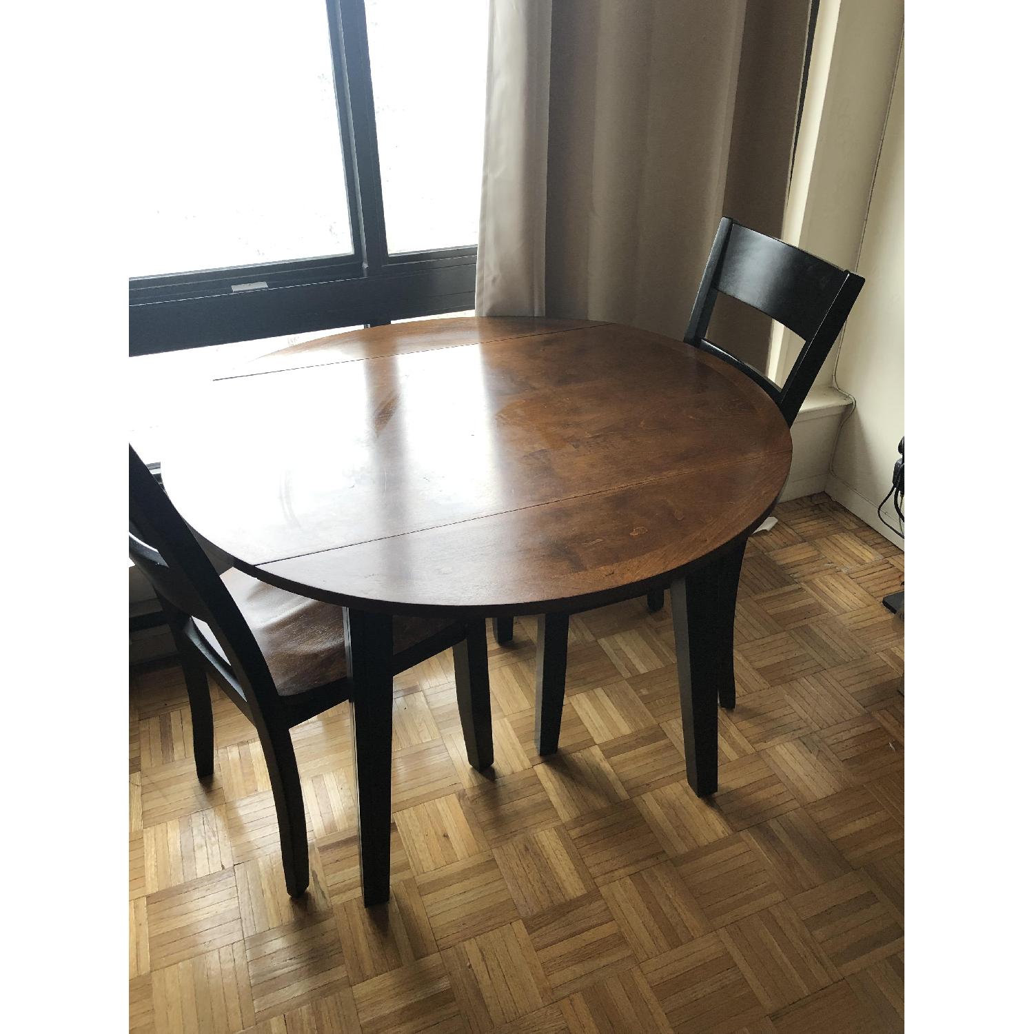 Bob's Blake Cherry Wood Dining Table w/ 2 Chairs - AptDeco