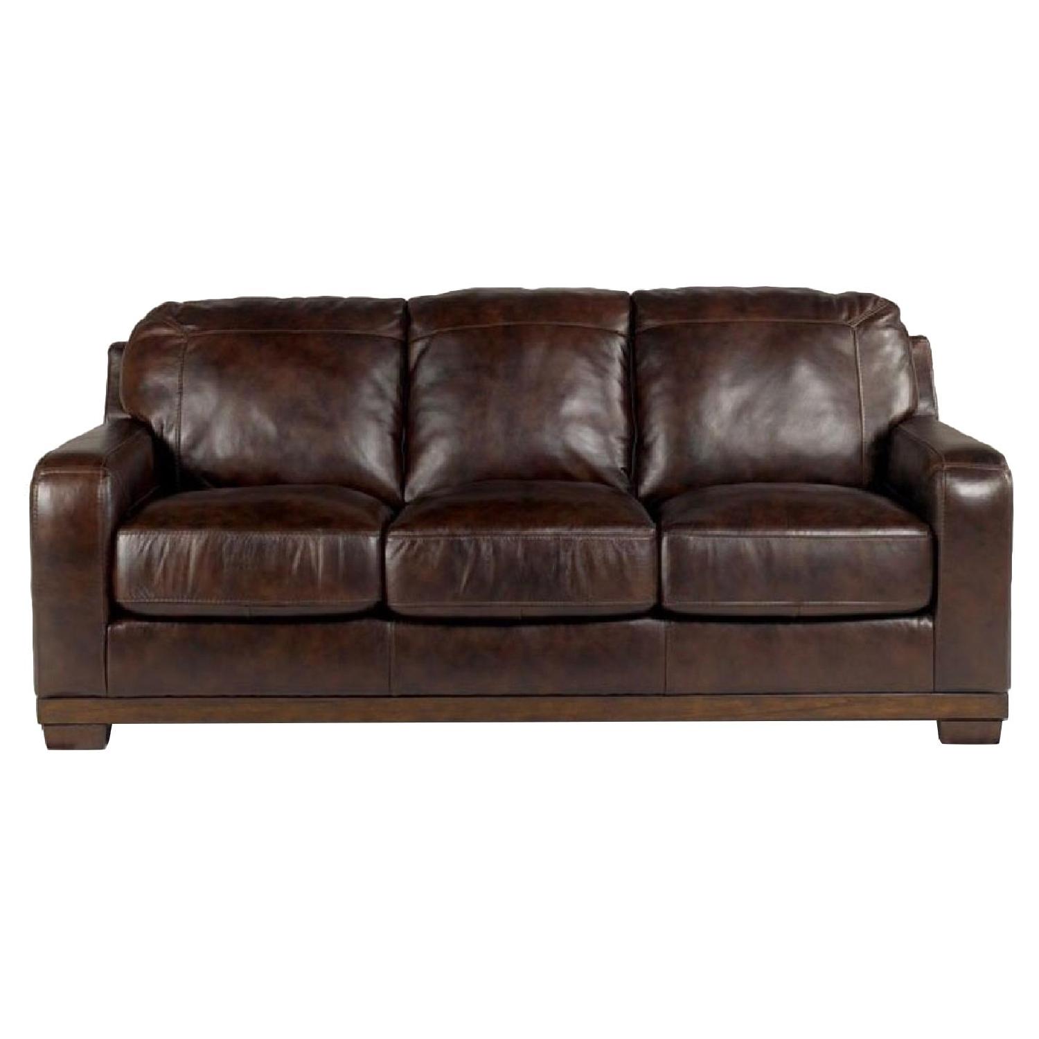 Ashley Crestwood Brown Leather Sofa - AptDeco