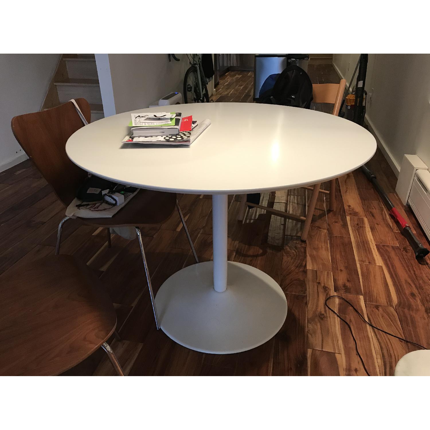 CB2 Odyssey White Round Dining Table - AptDeco