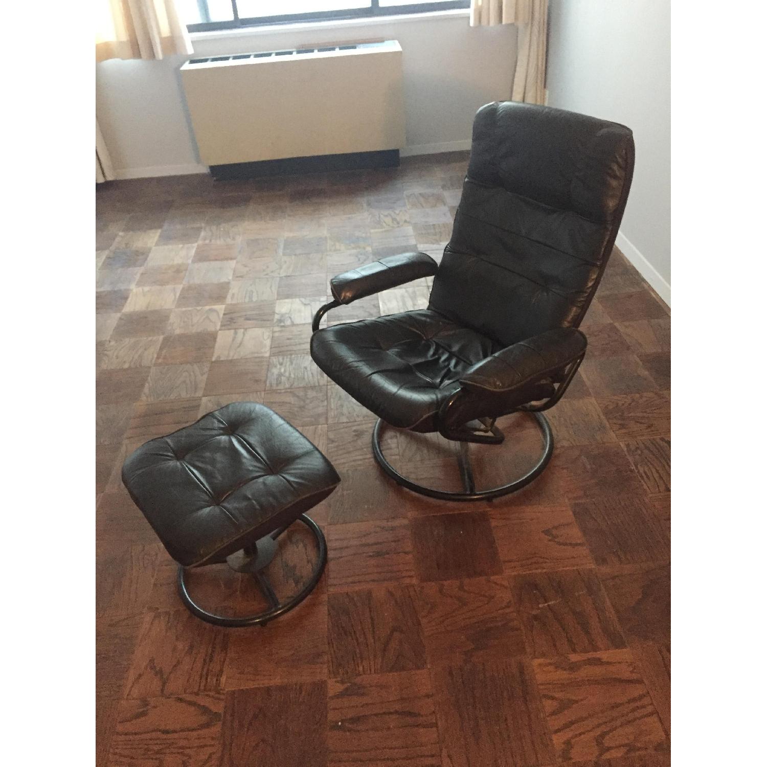 Black Leather Recliner & Foot Rest - AptDeco