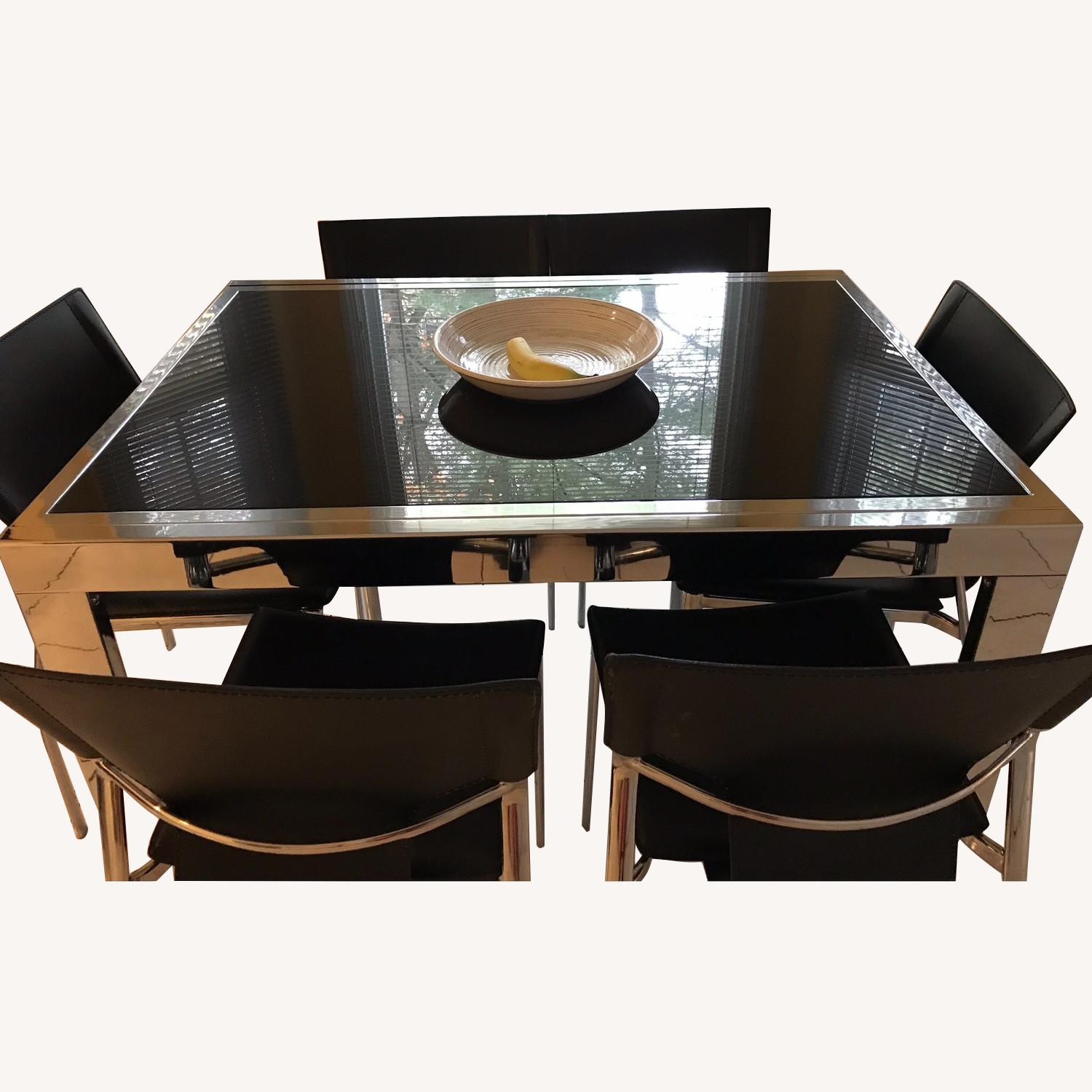 Glass Top Expandable Dining Table w/ 8 Black Chairs - AptDeco