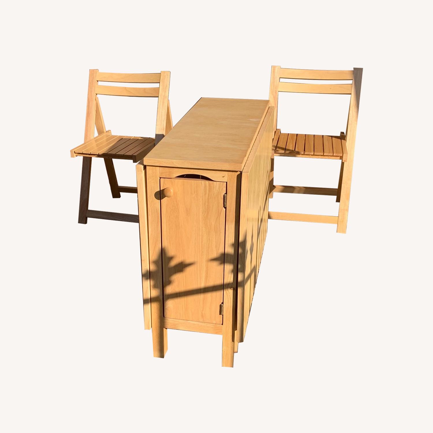 Table with hidden 4 chair storage - AptDeco