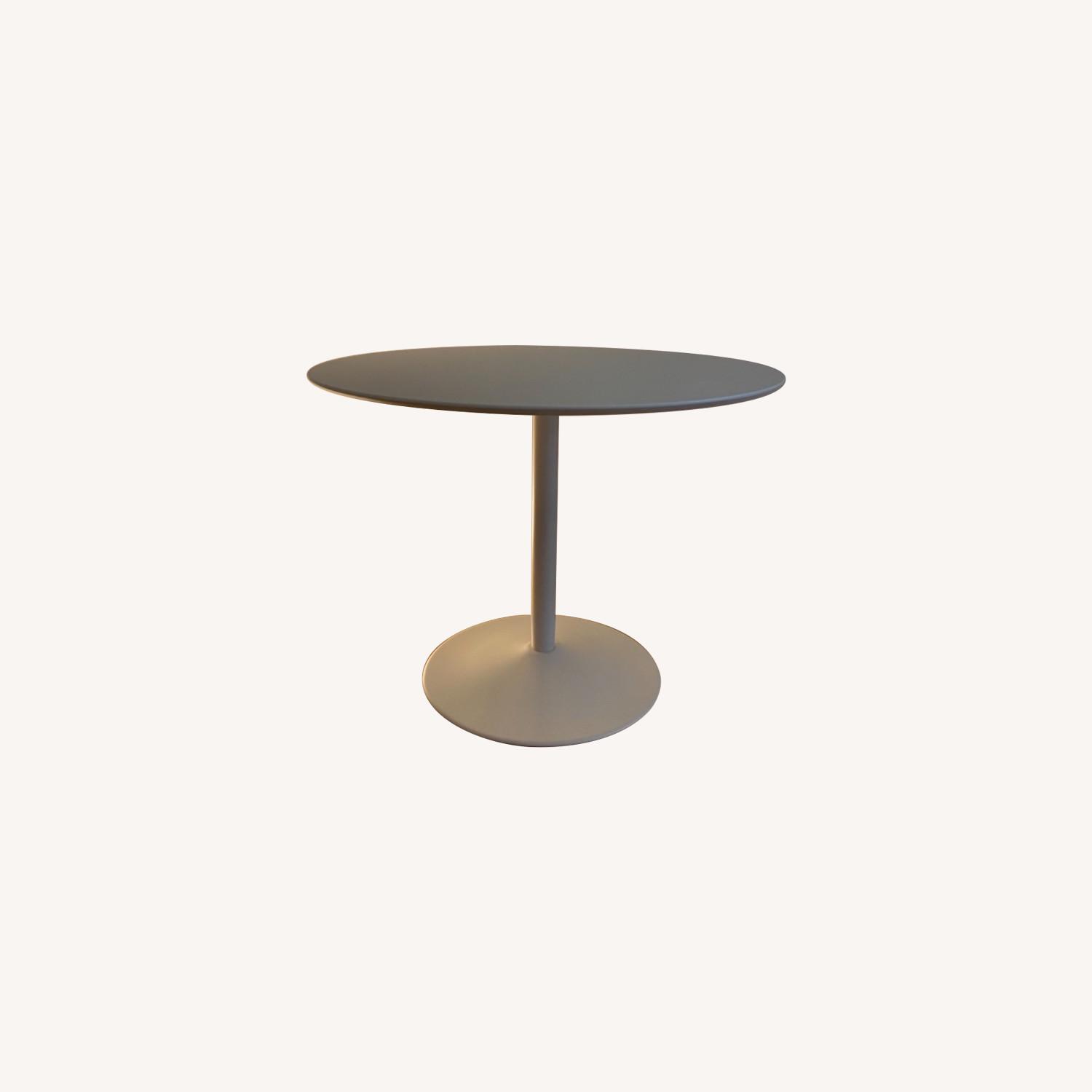CB2 Odyssey Round Dining Table - AptDeco