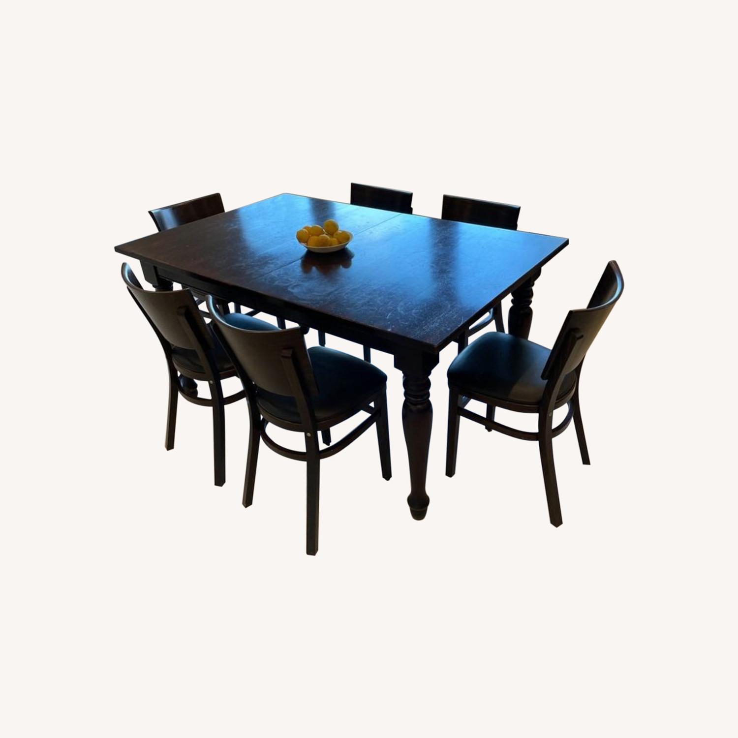 Crate and Barrel Solid Wood Extendable Dining Table - AptDeco