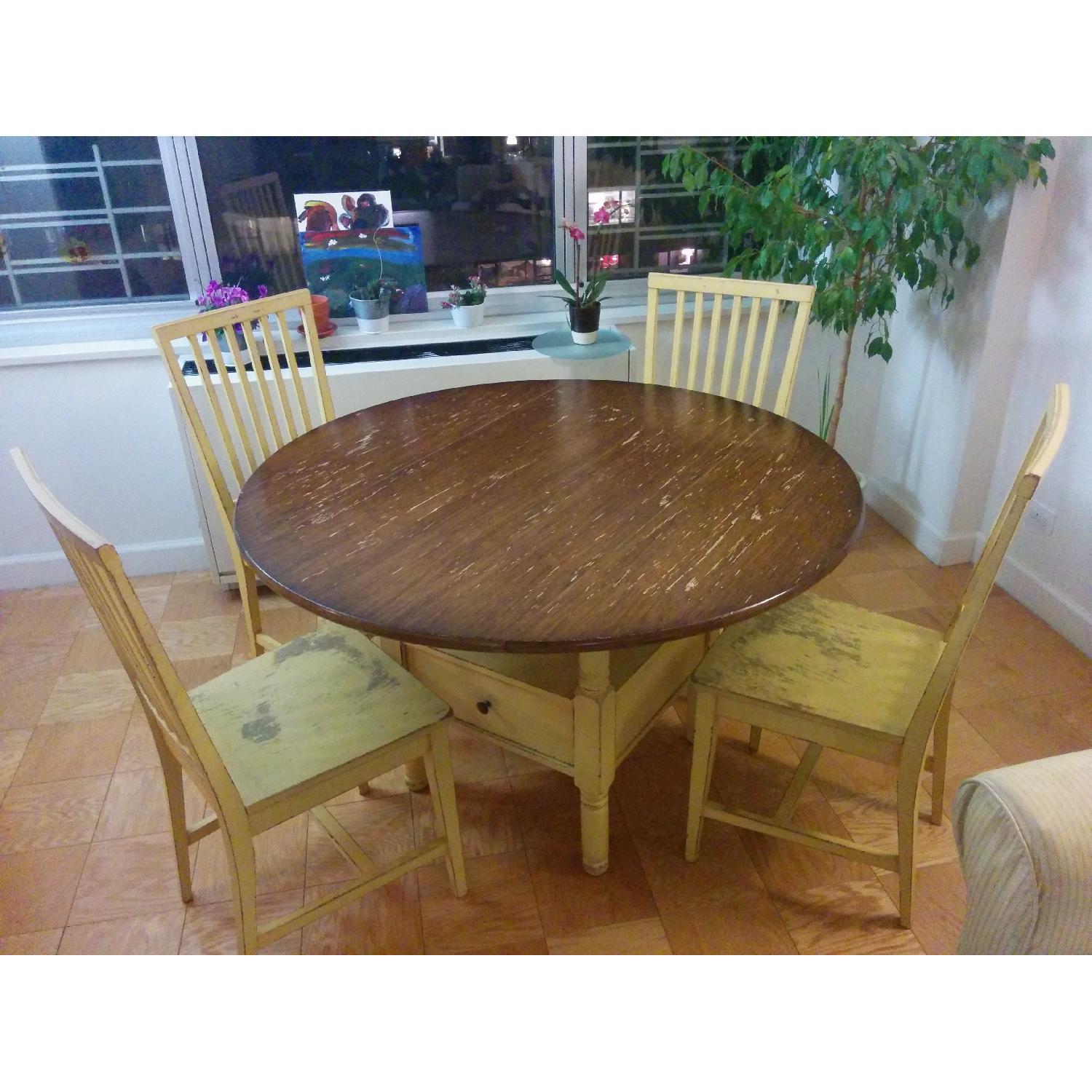 Crate & Barrel Basque Round Dining Table - AptDeco