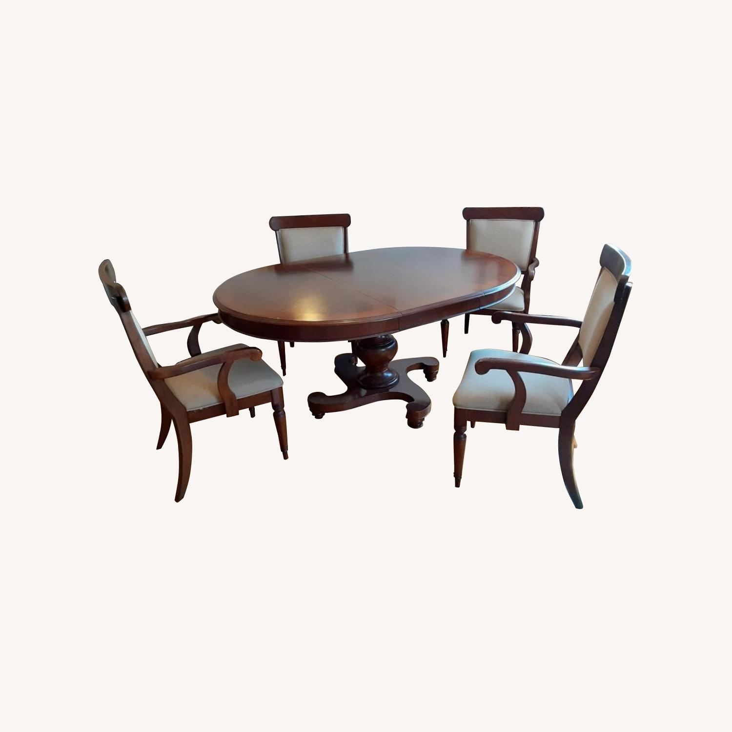 Oval Extendable Wood Pedestal Dining Table Set - AptDeco