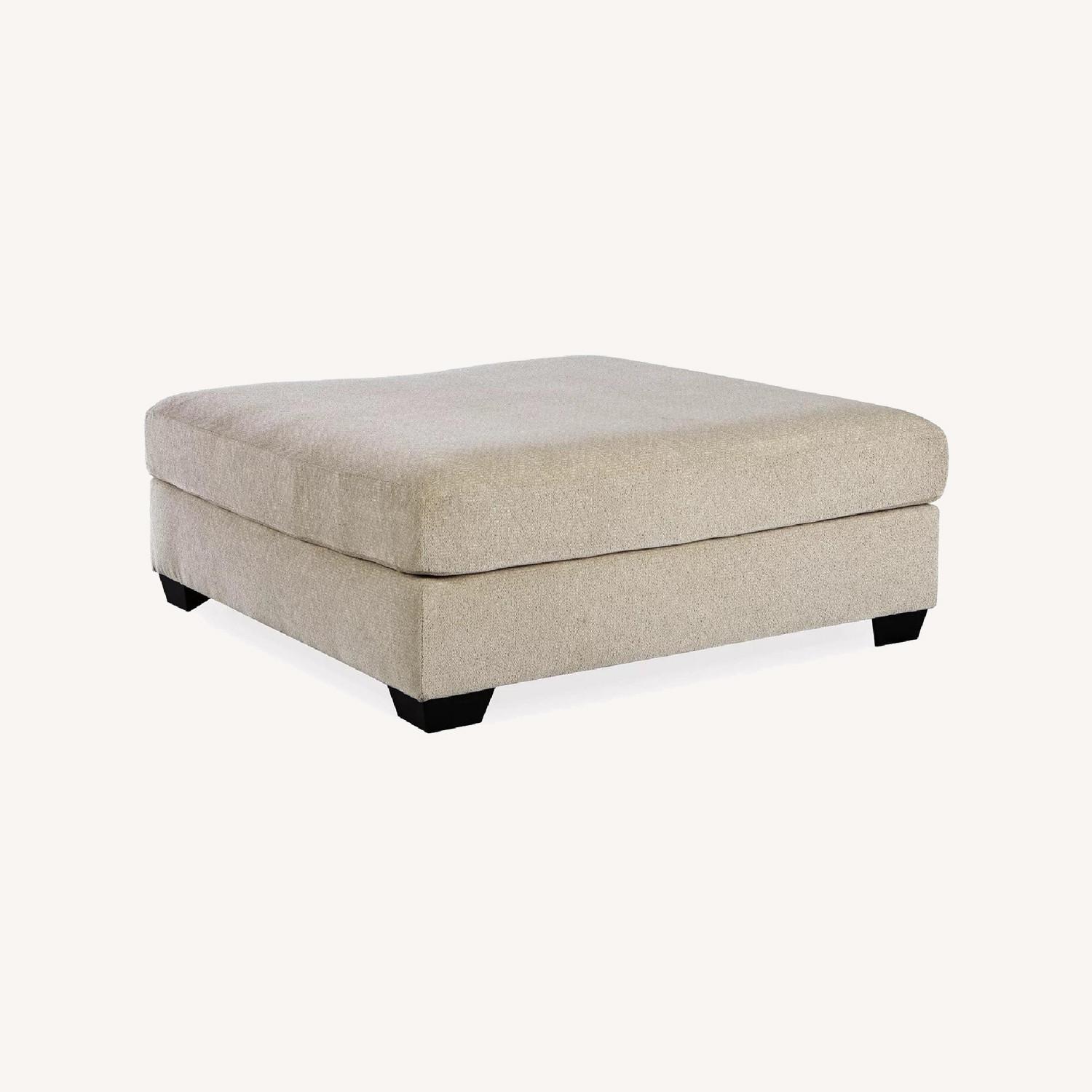 Ashley Furniture Enola Ottoman - AptDeco
