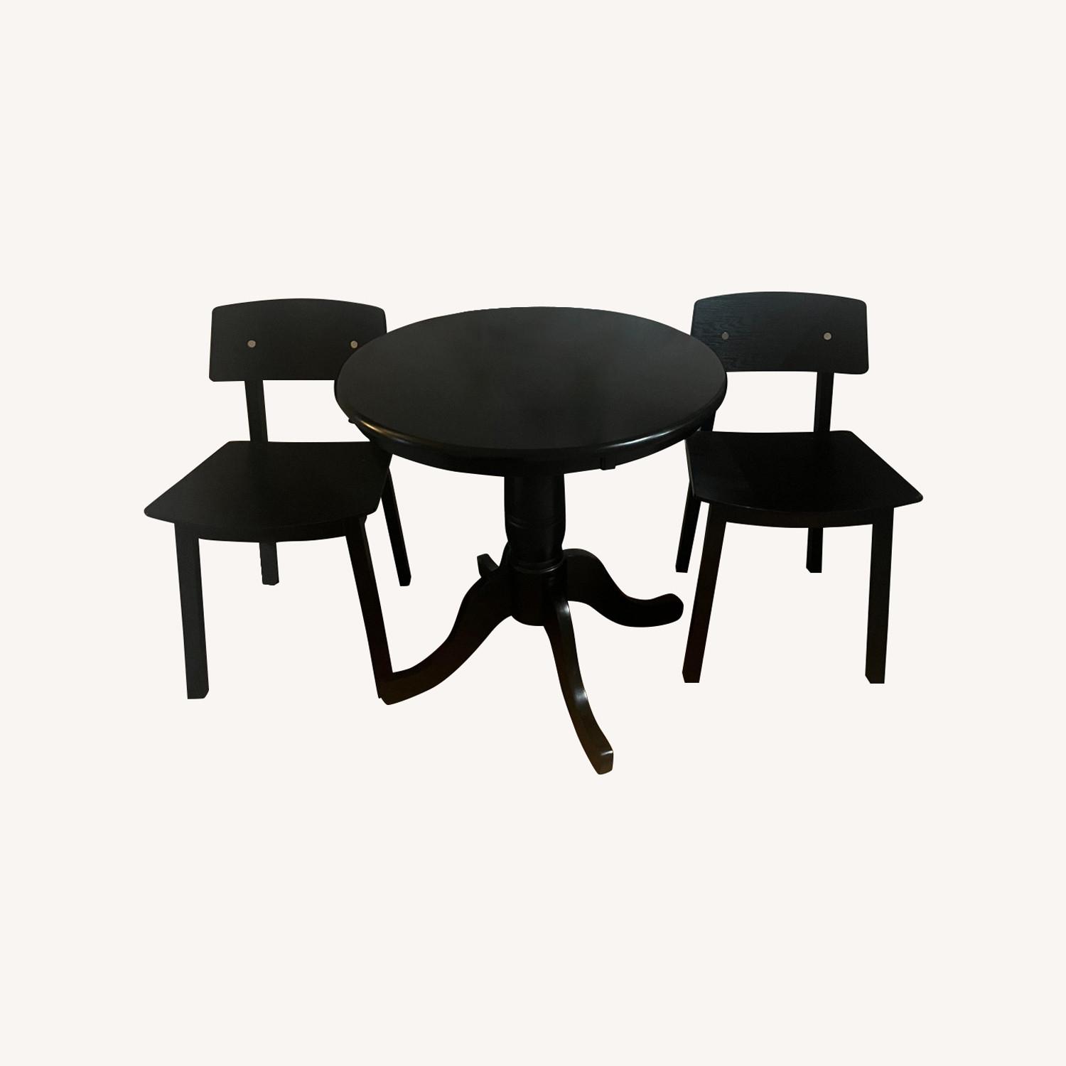 Black Round Table and Two Chairs - AptDeco