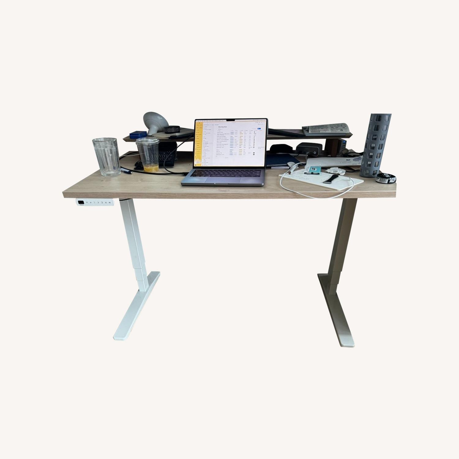 Uplift Sit / stand Desk 42x30 Maple Laminate - AptDeco