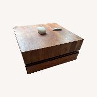 CB2 Spin Rotating Coffee Table AptDeco